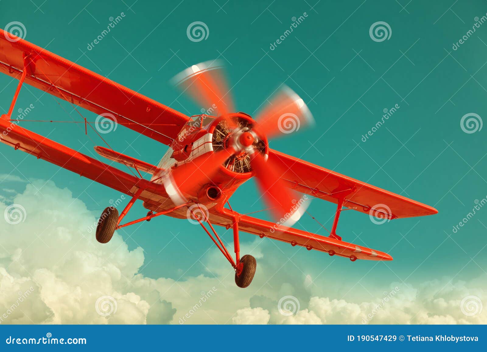 Red Biplane Flying in the Cloudy Sky. Retro Style Stock Image - Image ...