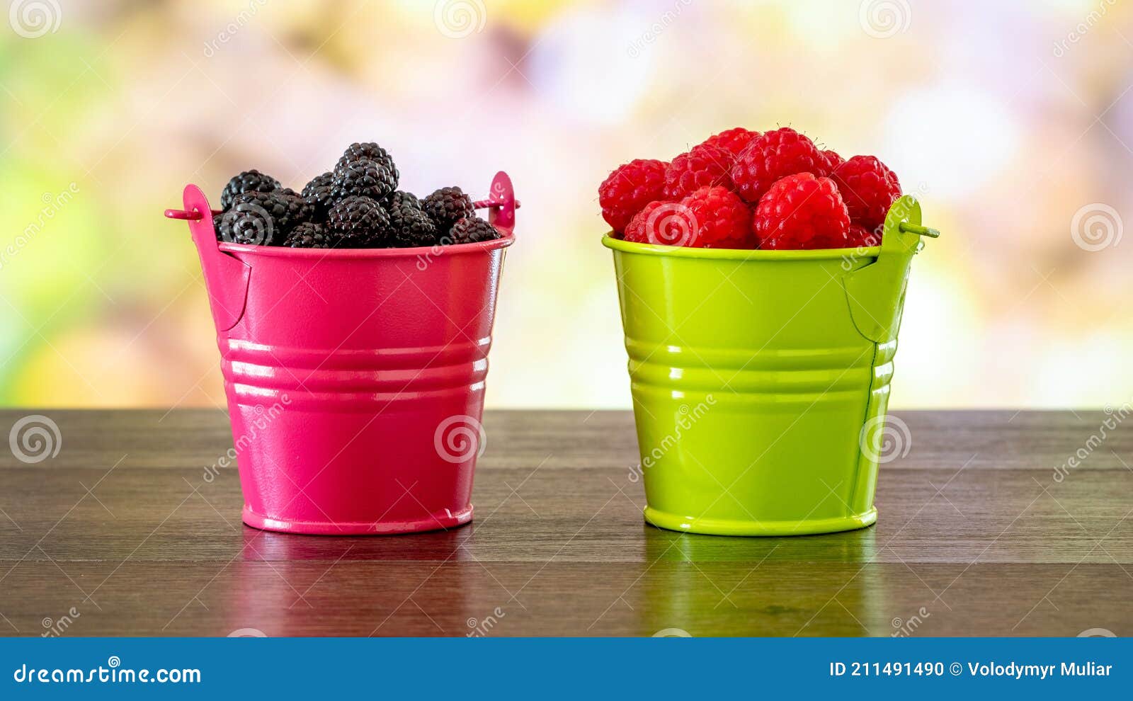 Red and Black Berries of Raspberries in Decorative Buckets on a Blurred ...