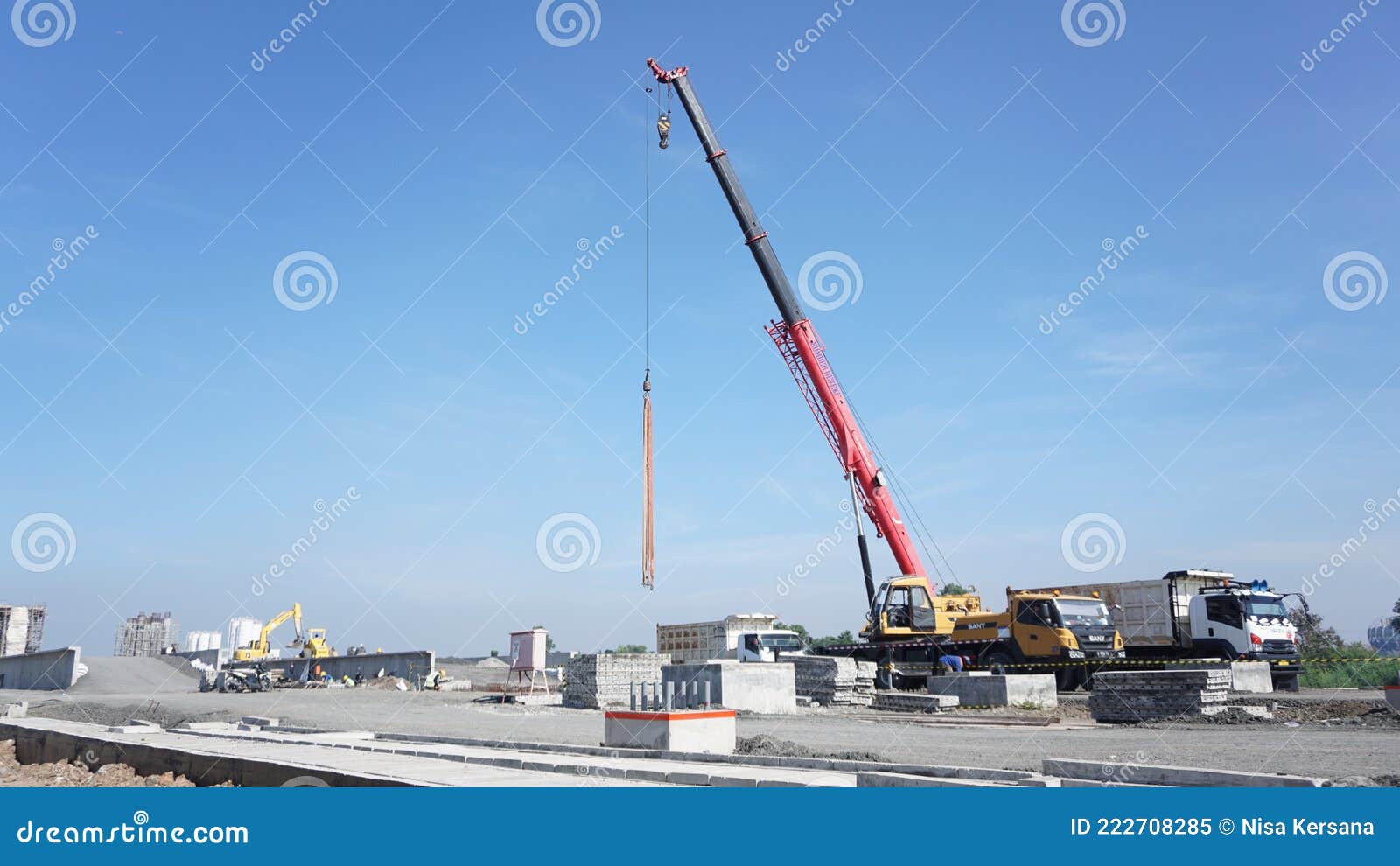 A Red Black Crane and Other Vehicles on a Construction Site Editorial ...