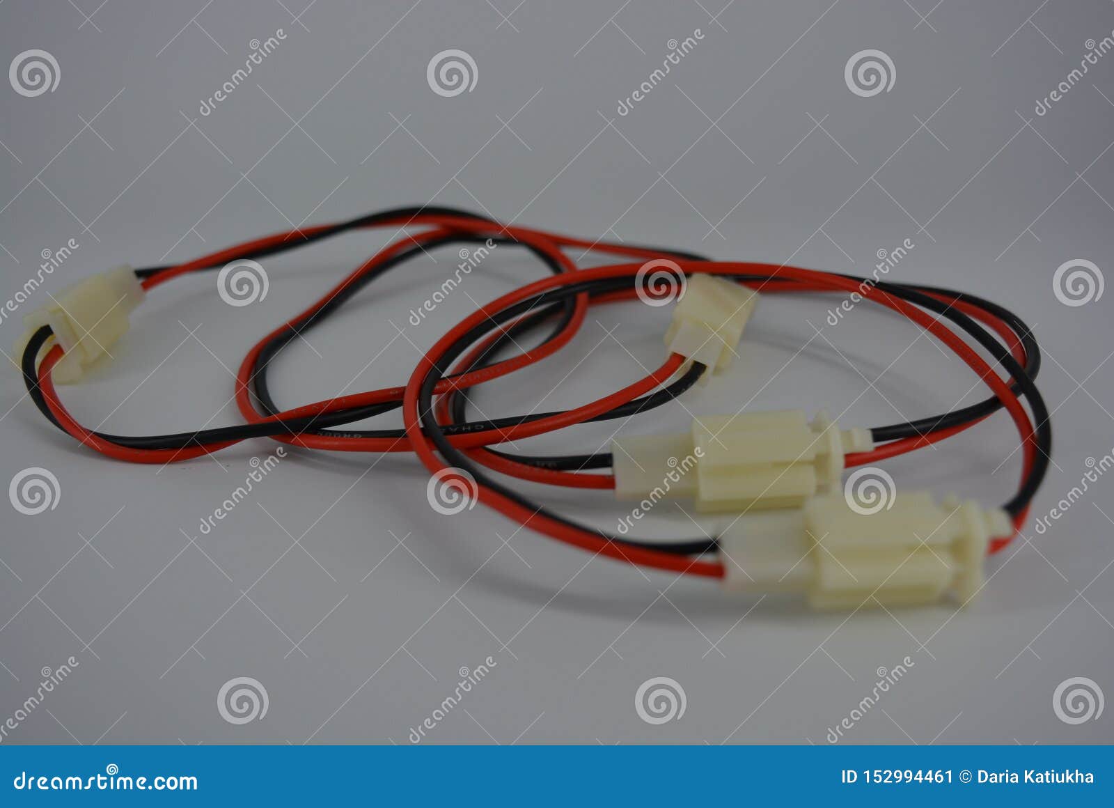 Red-black Electrical Cable with White Plugs on a White Background ...