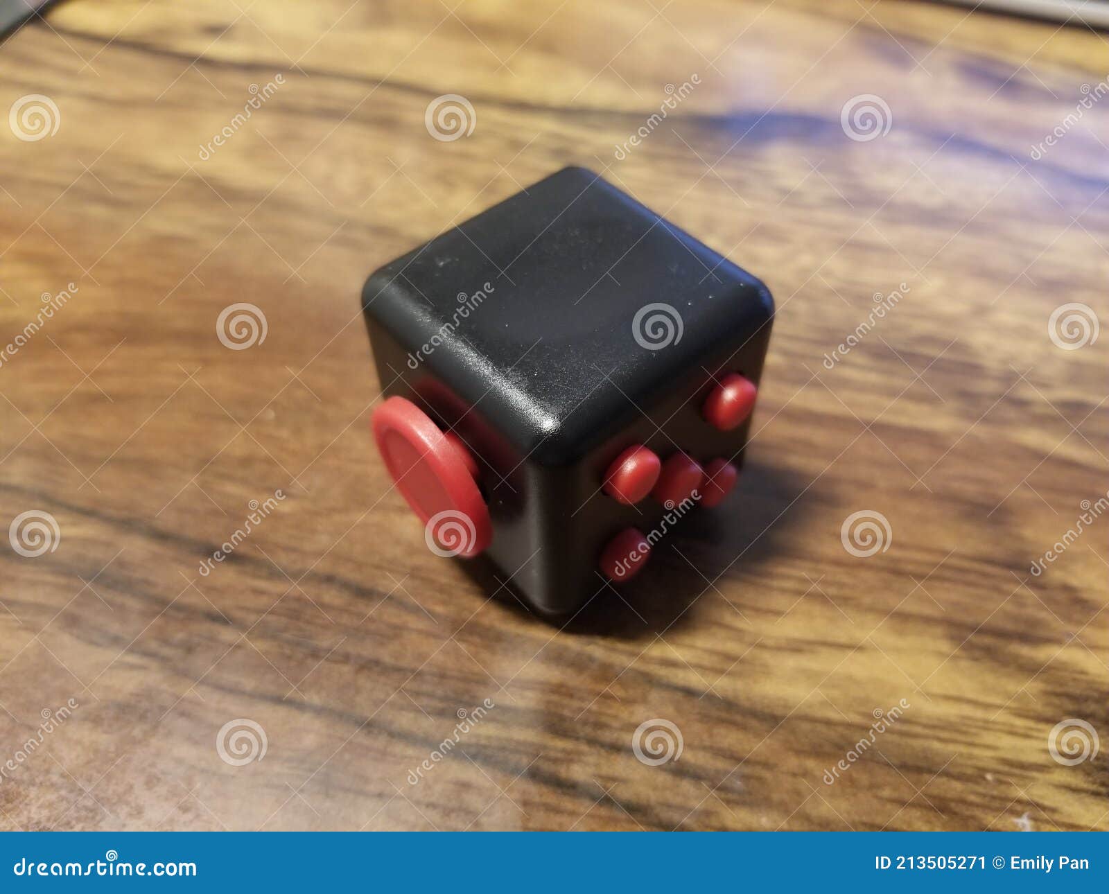 Red and Black Fidget Cube Sitting on a Table Stock Image - Image of ...