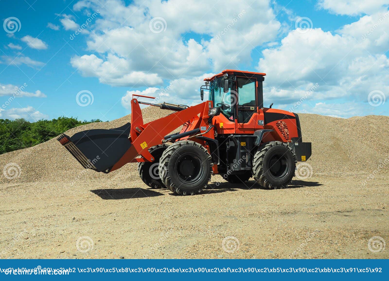 A Red-black Front-end Loader with Small Wheels Against the Background ...
