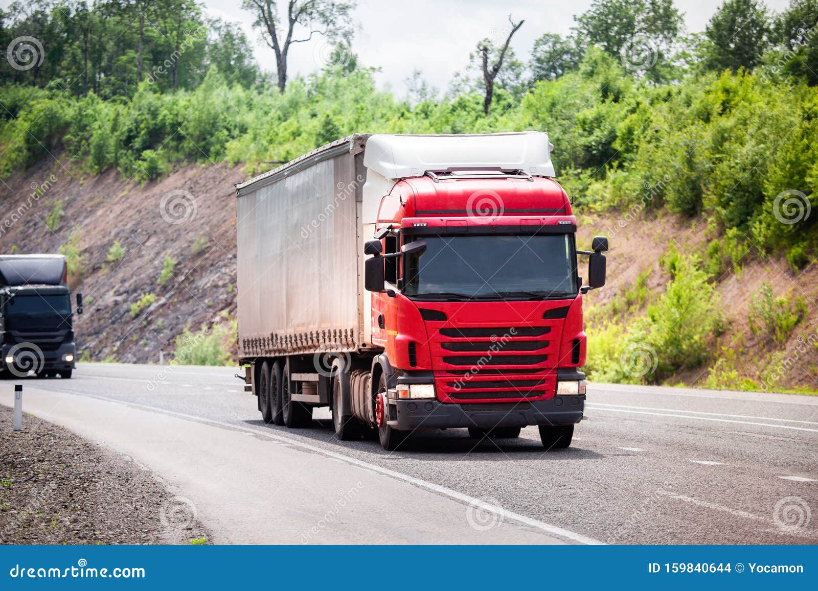 Two Trucks Moving by a Road Stock Photo - Image of merchandise, cargo ...