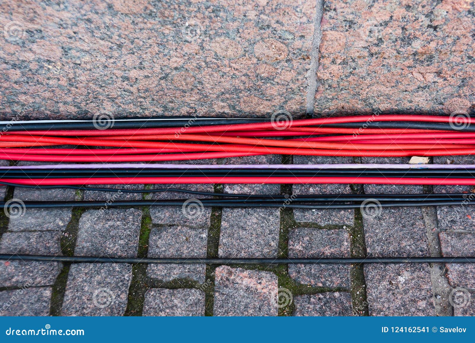 Red and Black Wire on Paving Stones Stock Image - Image of supply ...