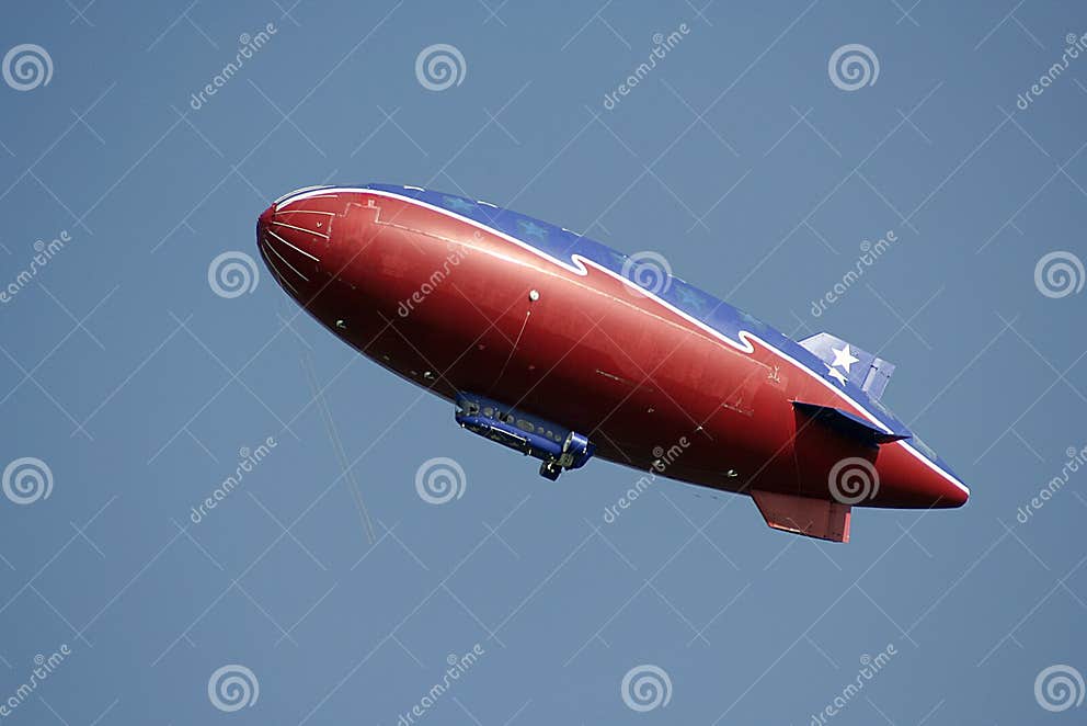 Red blimp in blue sky stock image. Image of aircraft, floating - 997237