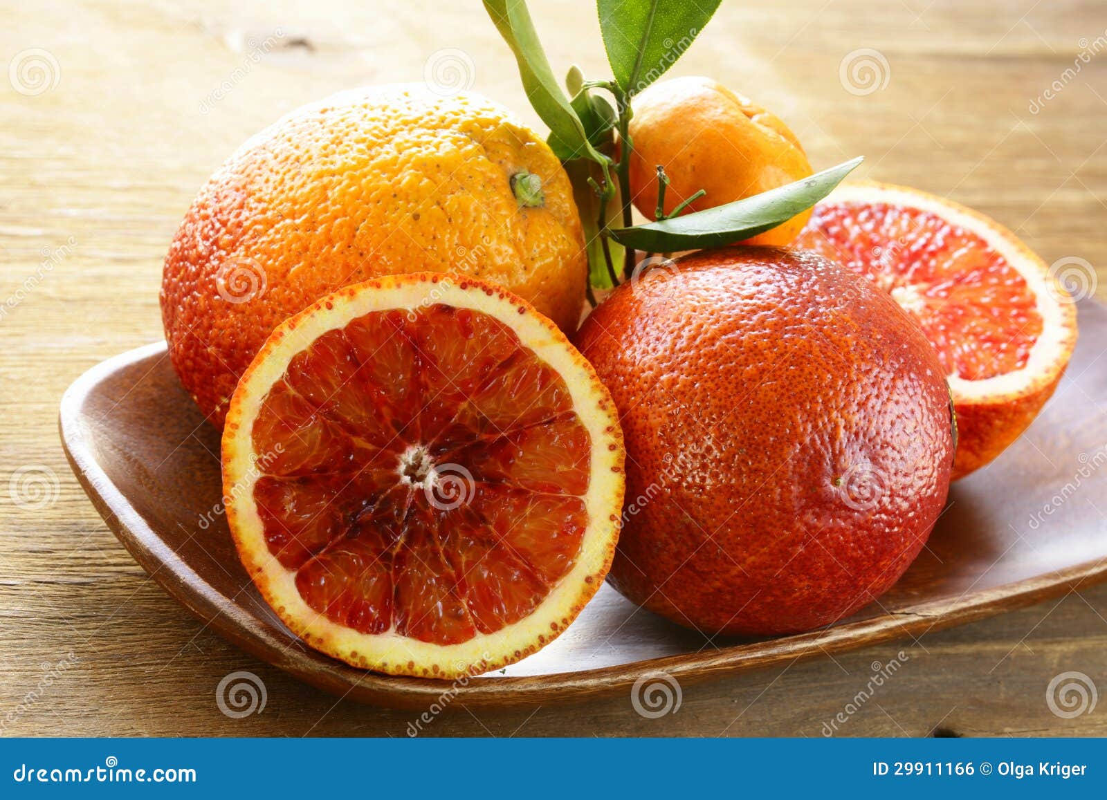 Red (bloody) Oranges on a Wooden Plate Stock Photo - Image of vibrant ...