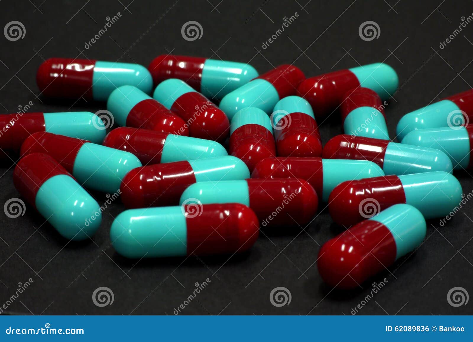 Red and Blue Capsules on Black Background Stock Photo - Image of blue ...