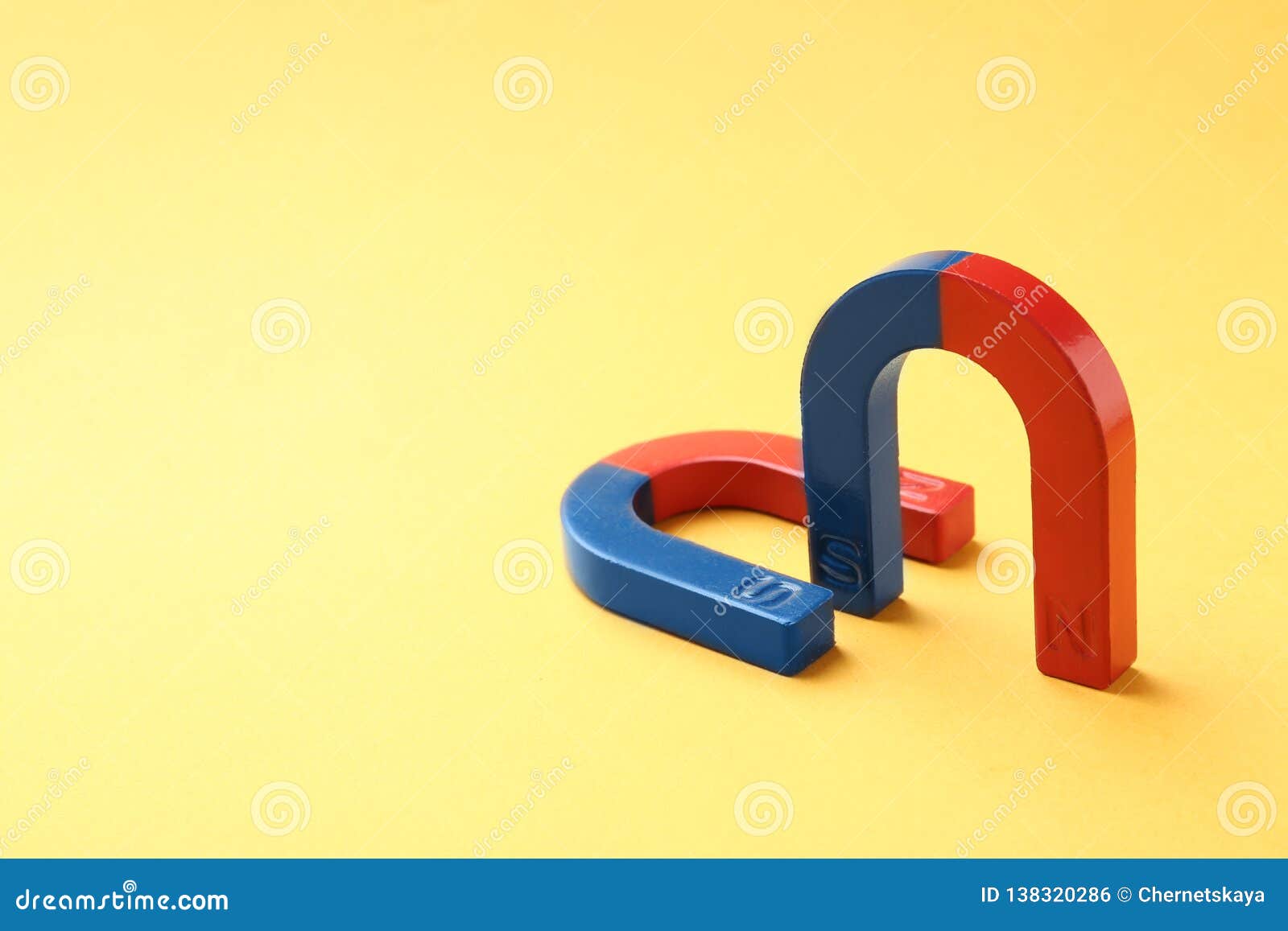Red and Blue Horseshoe Magnets on Color Background Stock Photo - Image ...