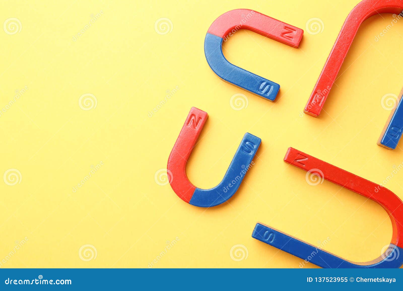 Red and Blue Horseshoe Magnets on Color Background Stock Image - Image ...