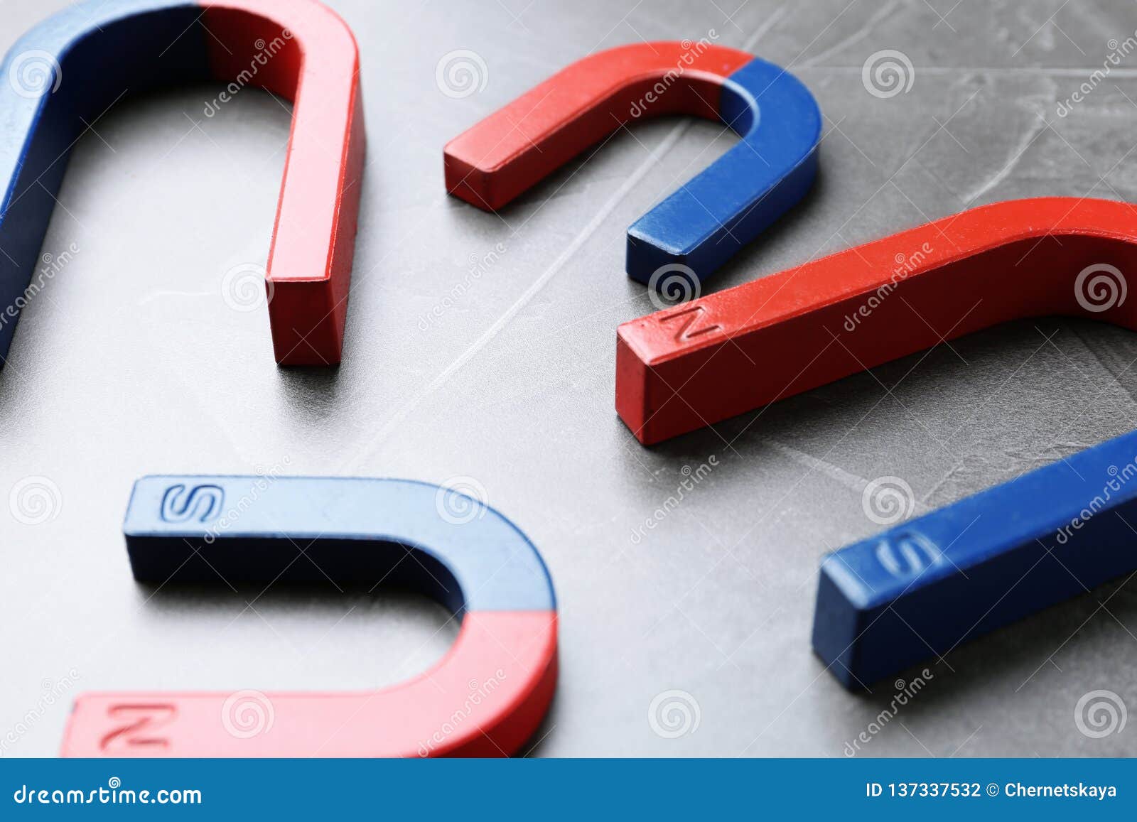 Red and Blue Horseshoe Magnets on Grey Stock Photo - Image of ...