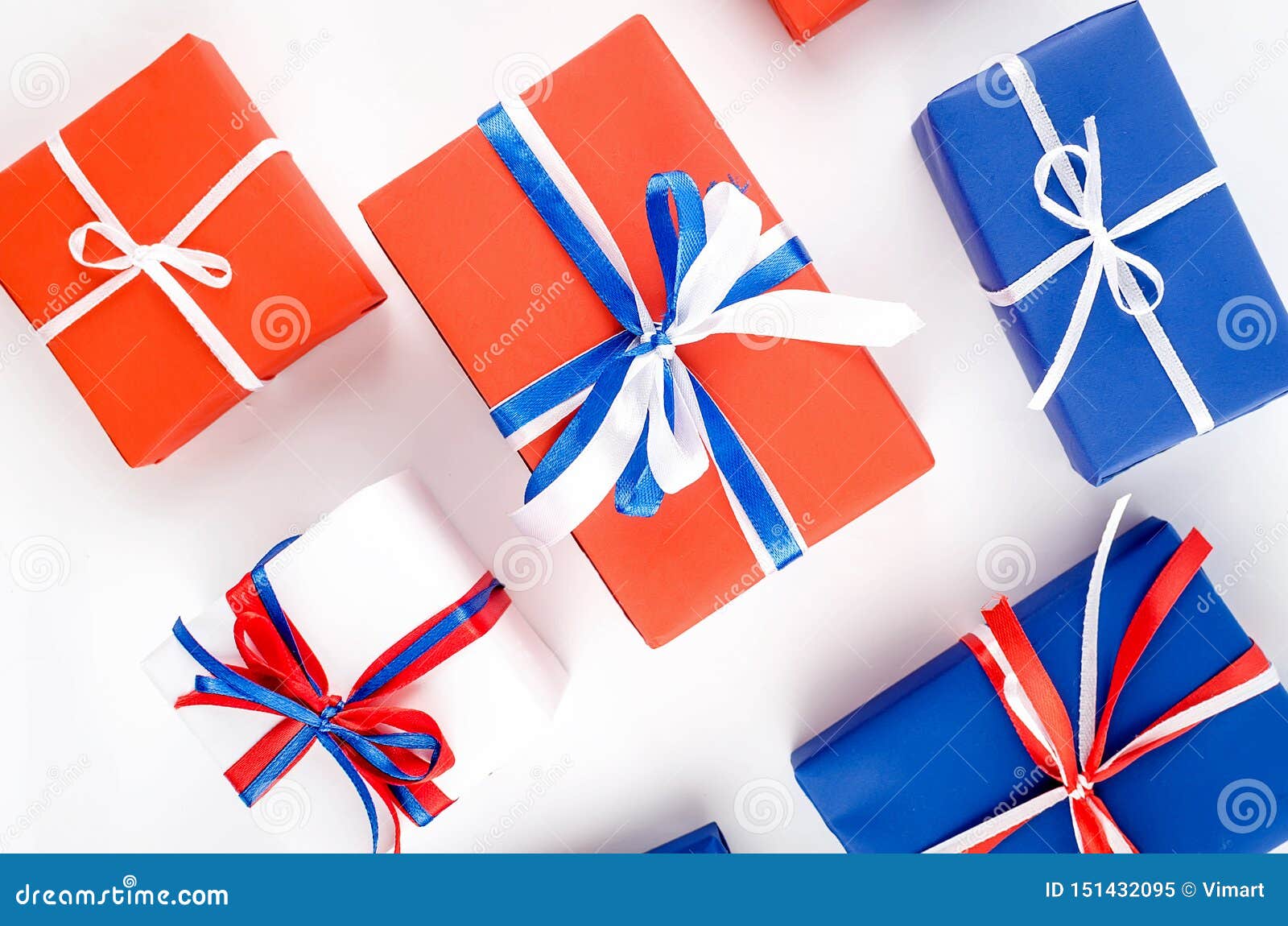 Red, Blue and White Gift Boxes with Ribbons on a White Background Stock ...
