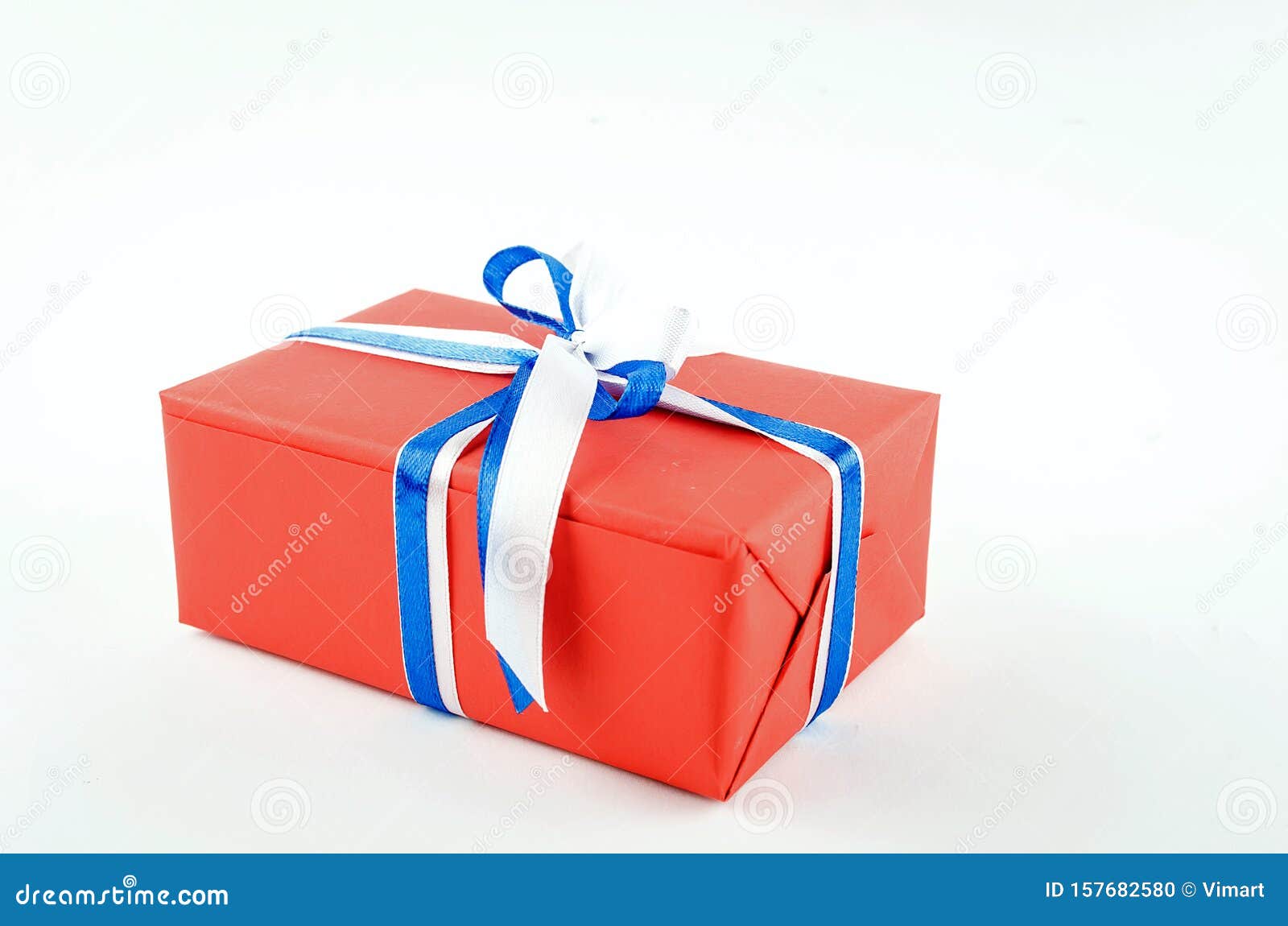 Red, Blue and White Gift Boxes with Ribbons on a White Background Stock ...