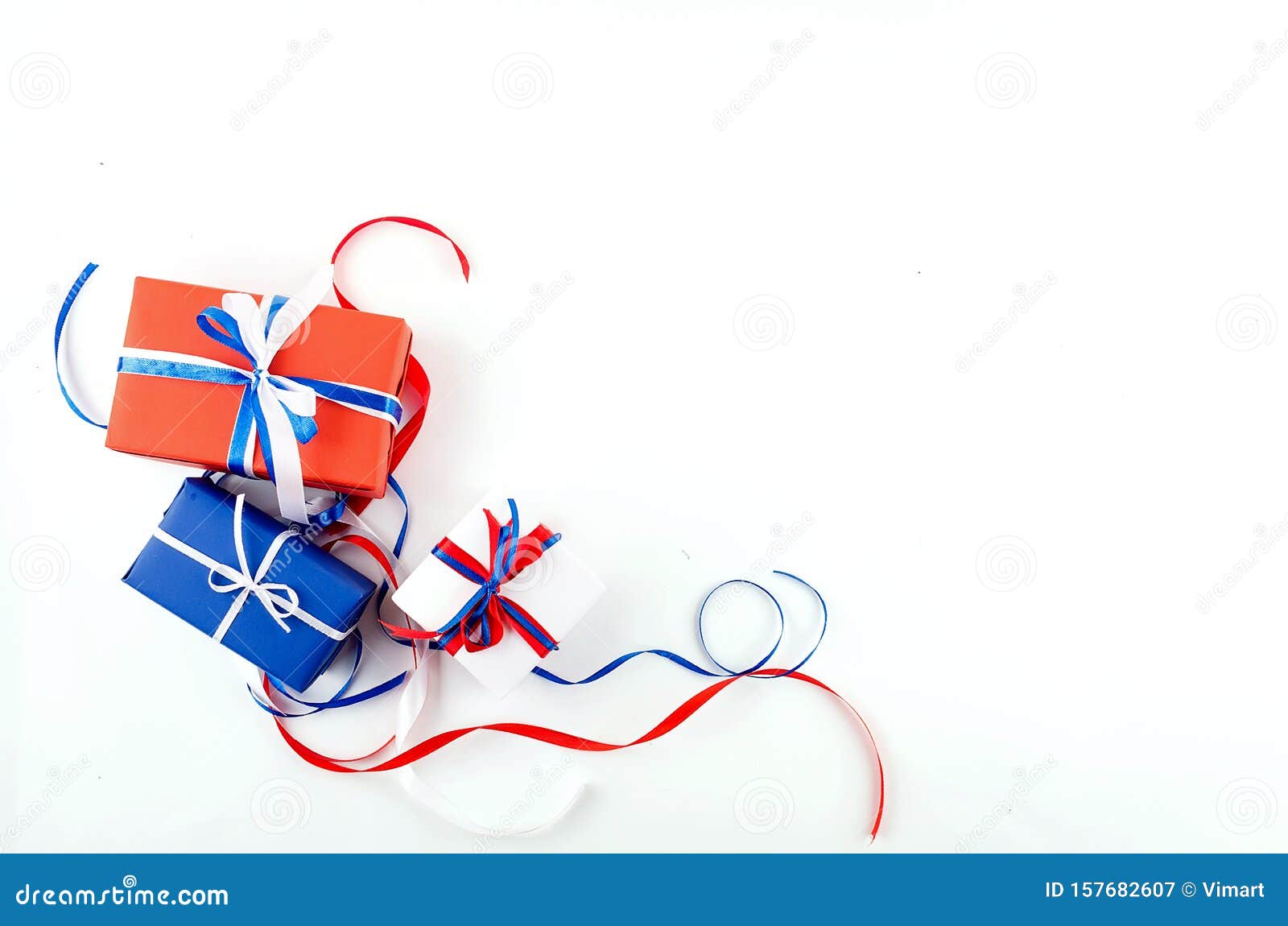 Red, Blue and White Gift Boxes with Ribbons on a White Background Stock ...