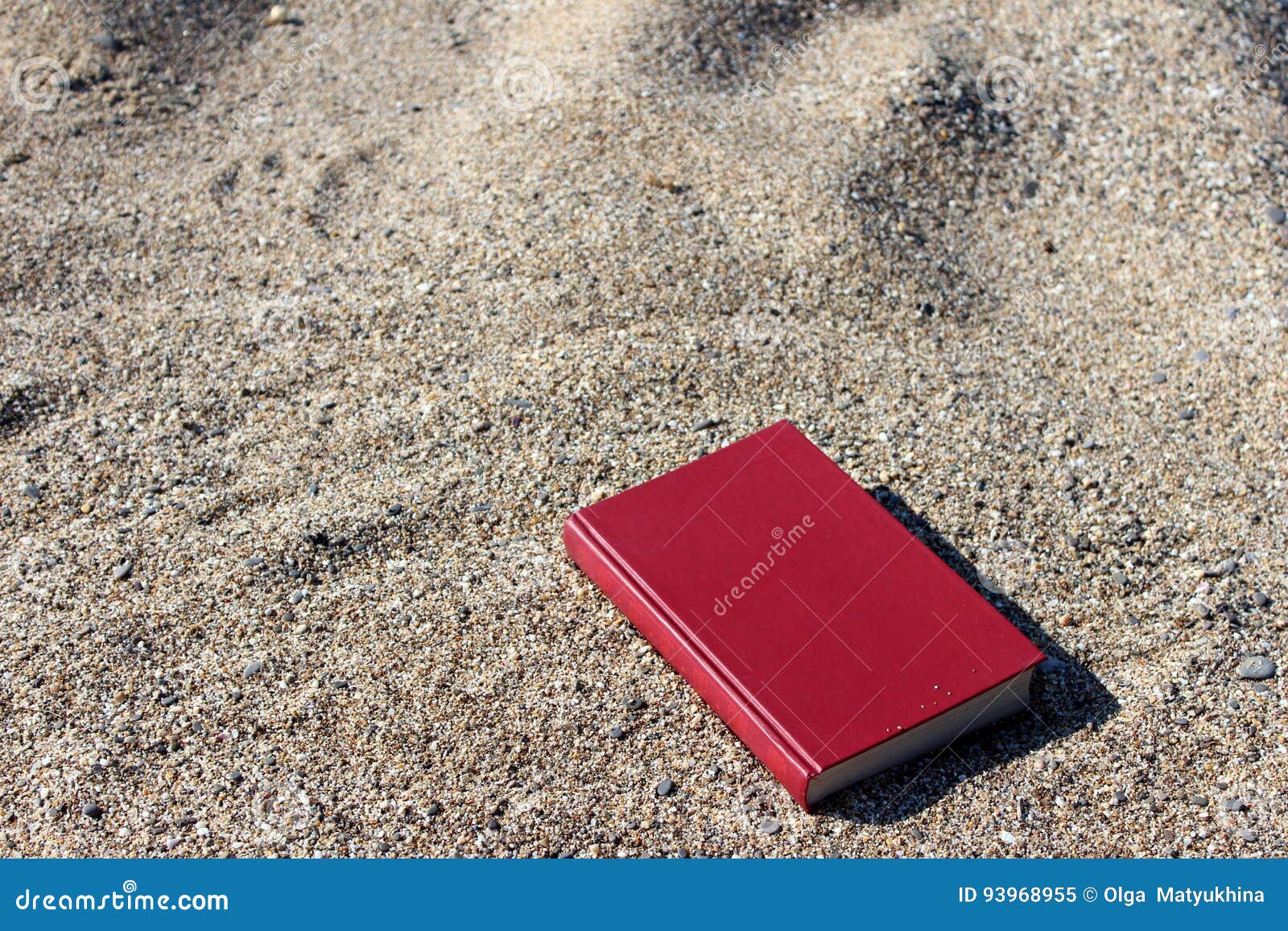 Red Book on the Sand on a Blurred Background, Sand on the Book, Grains ...