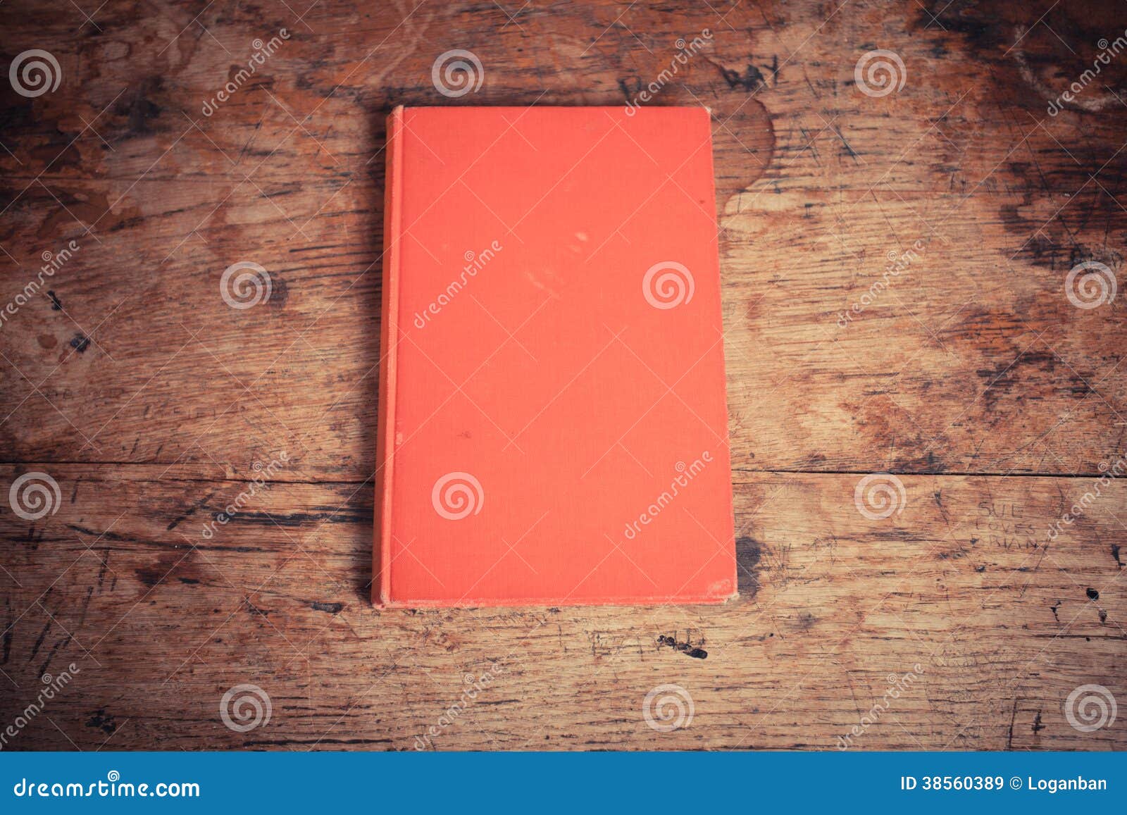 Red book on a wood table stock image. Image of book, library - 38560389