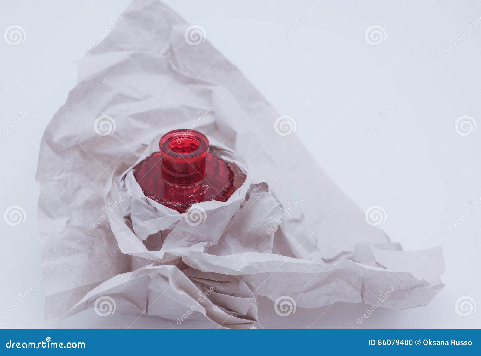 Red Bottle and Crumpled Paper Stock Photo - Image of decoration, glass ...