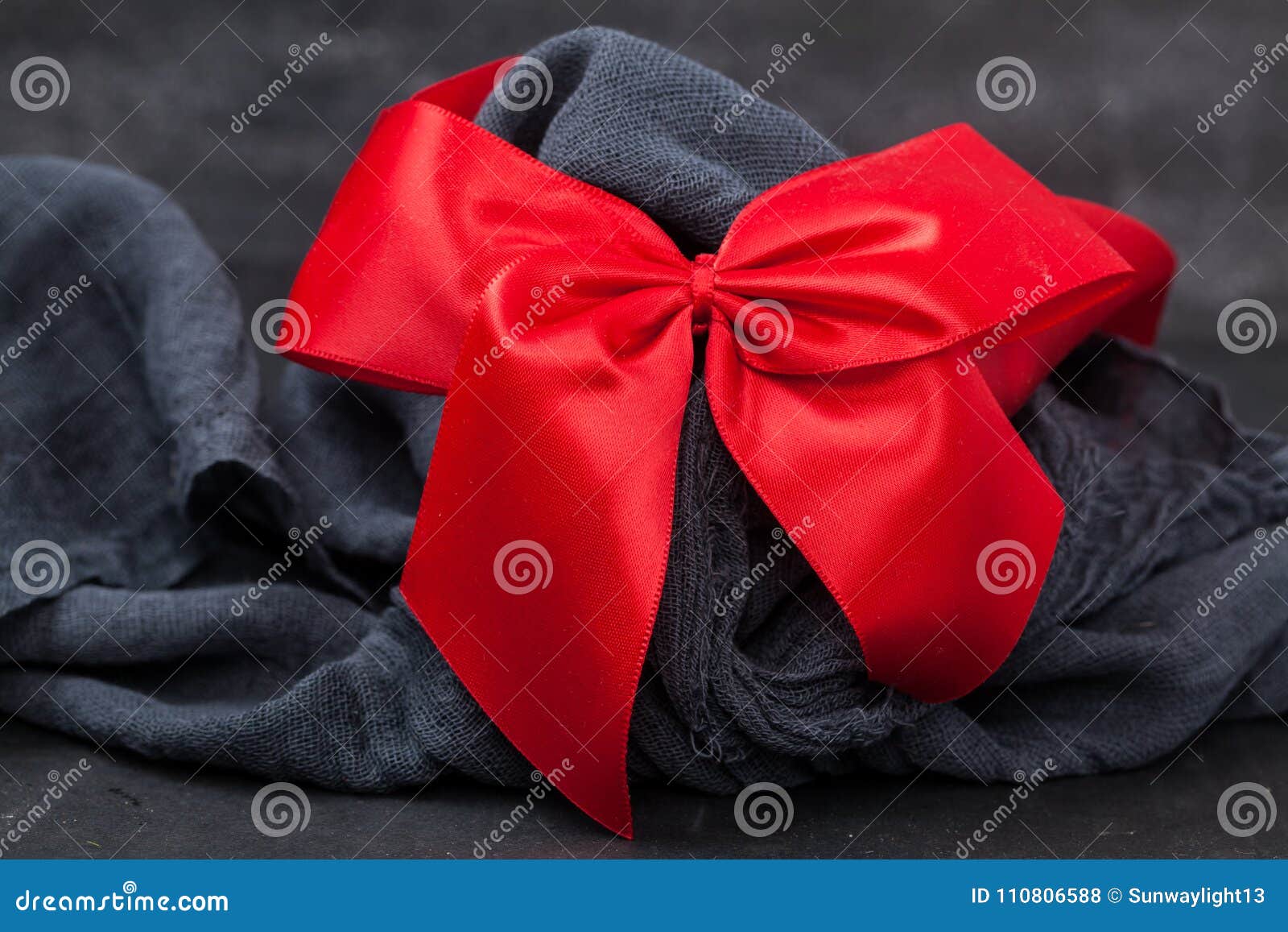 Red bow on a black stock photo. Image of holiday, ornament - 110806588
