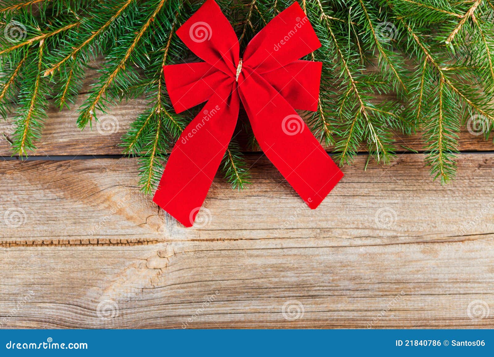 Red Bow and Fir Tree Branch on Wooden Board Stock Photo - Image of ...