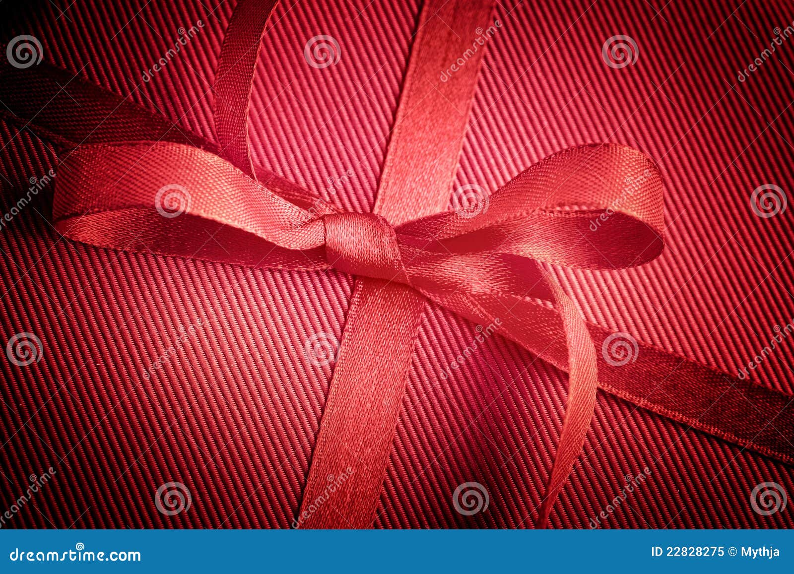 Red bow on present stock image. Image of design, birthday - 22828275
