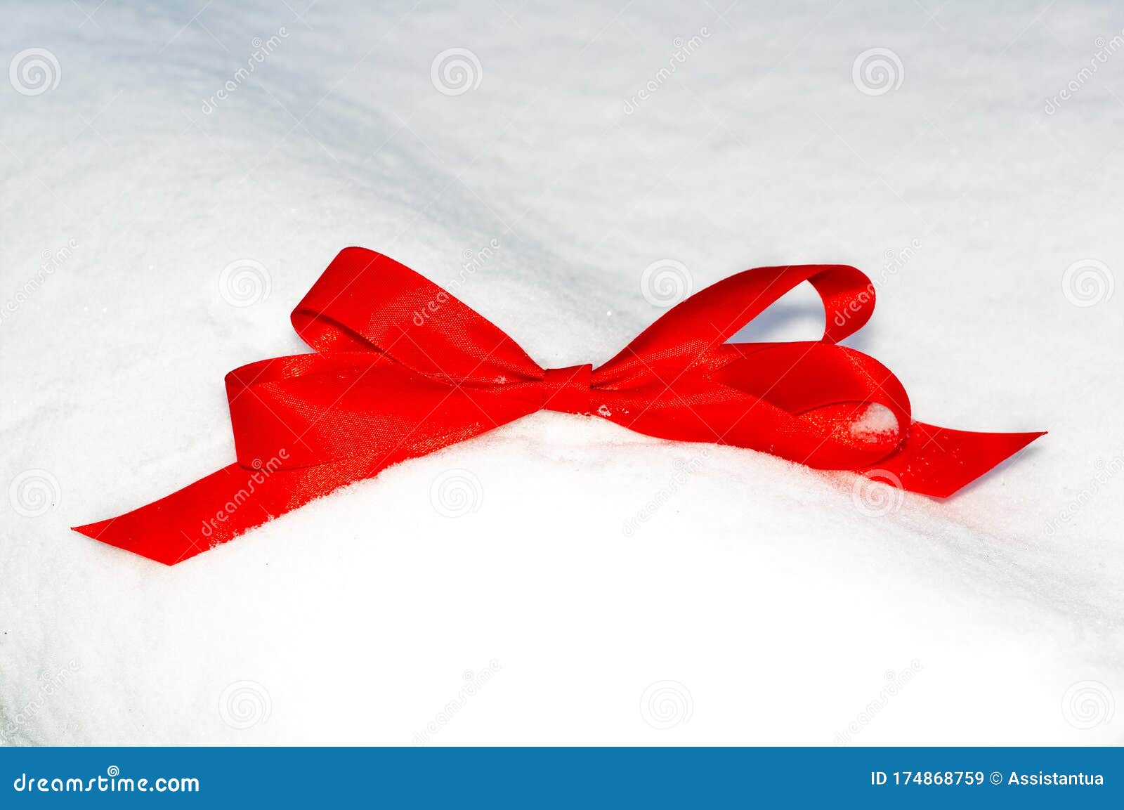 Red bow in the snow stock image. Image of vintage, season - 174868759