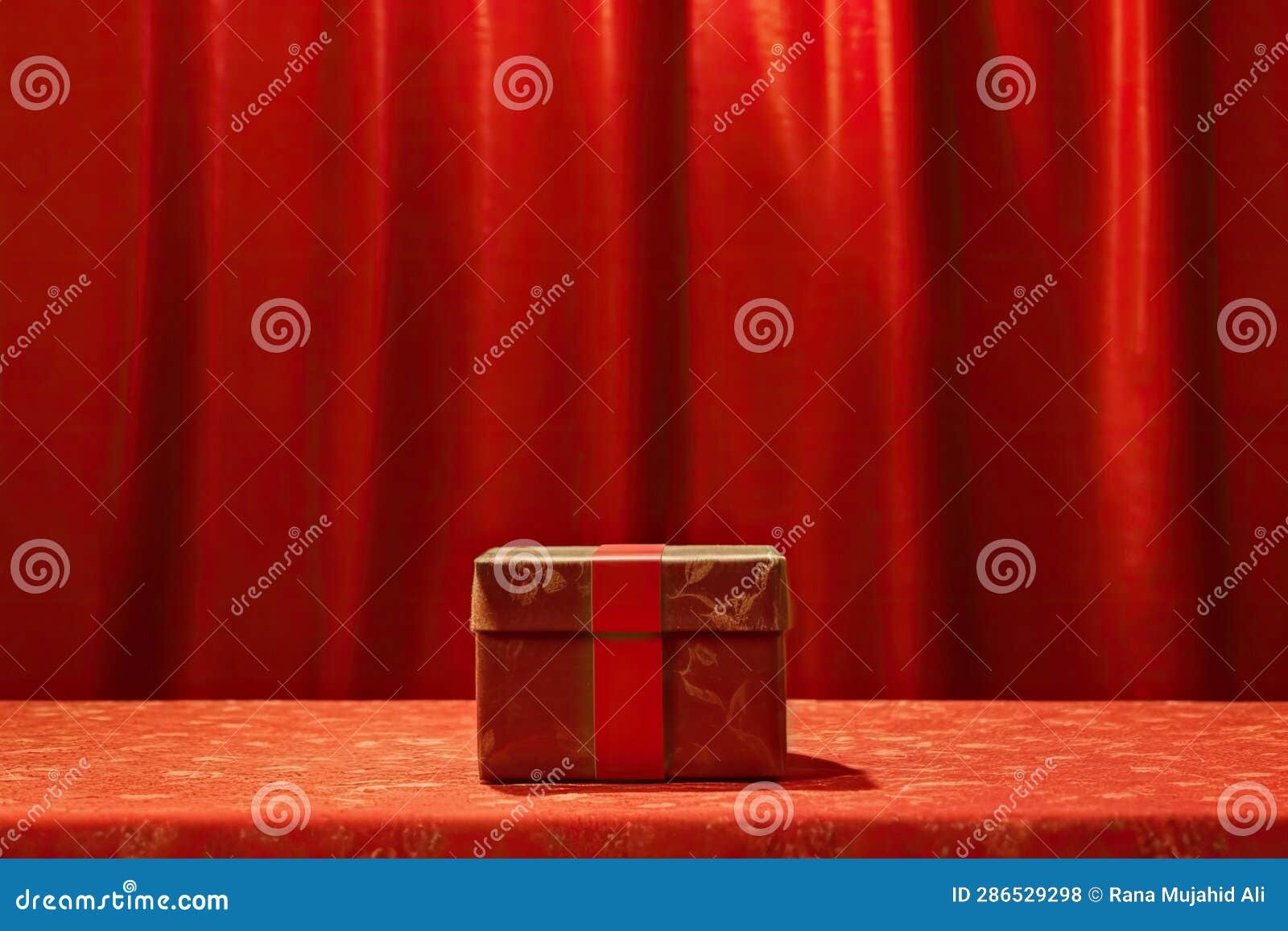 A Red Box with a Red Envelope on a Table in Front of a Red Curtain ...