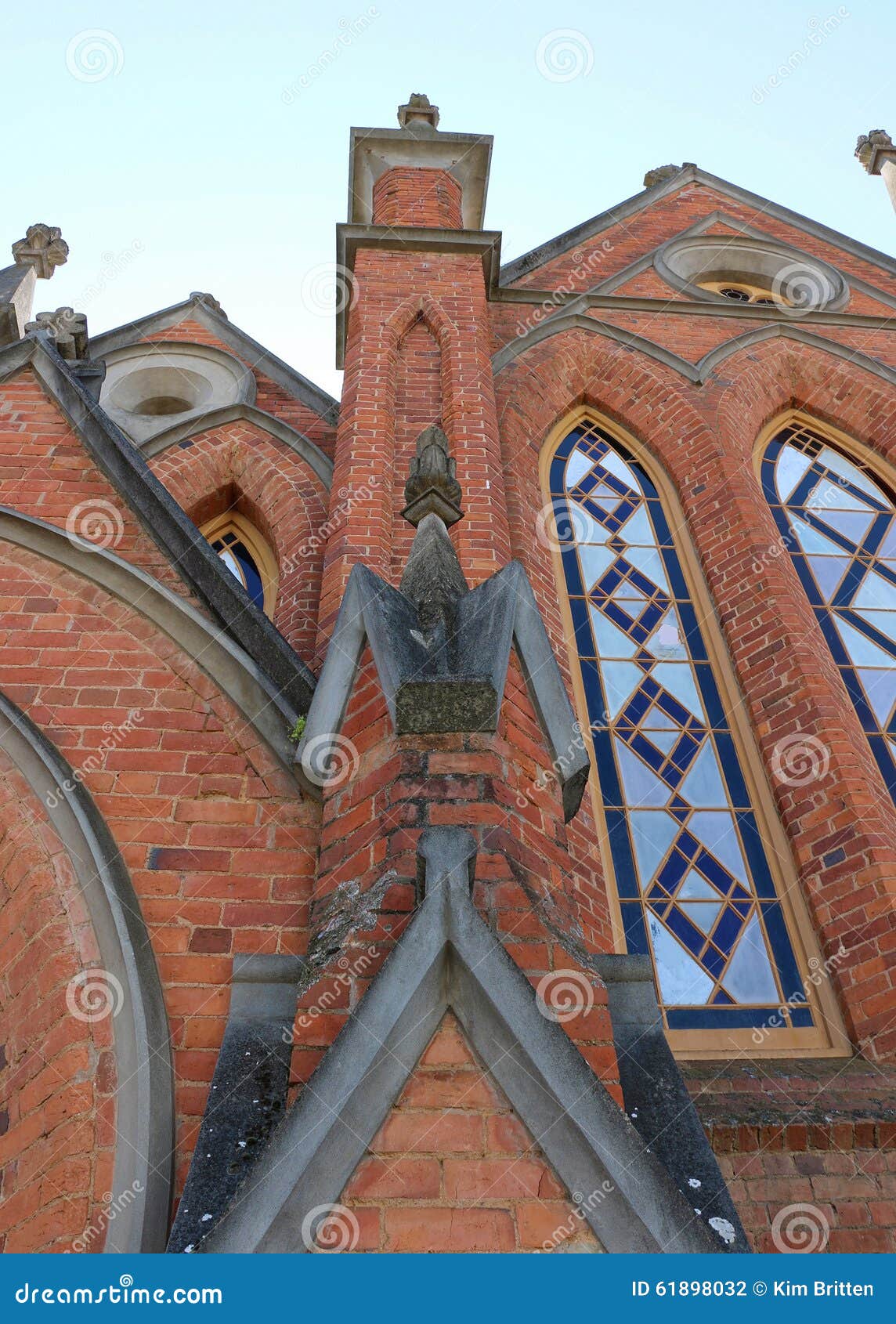 Red Brick Church with Blue Stained Glass Windows Stock Photo - Image of ...