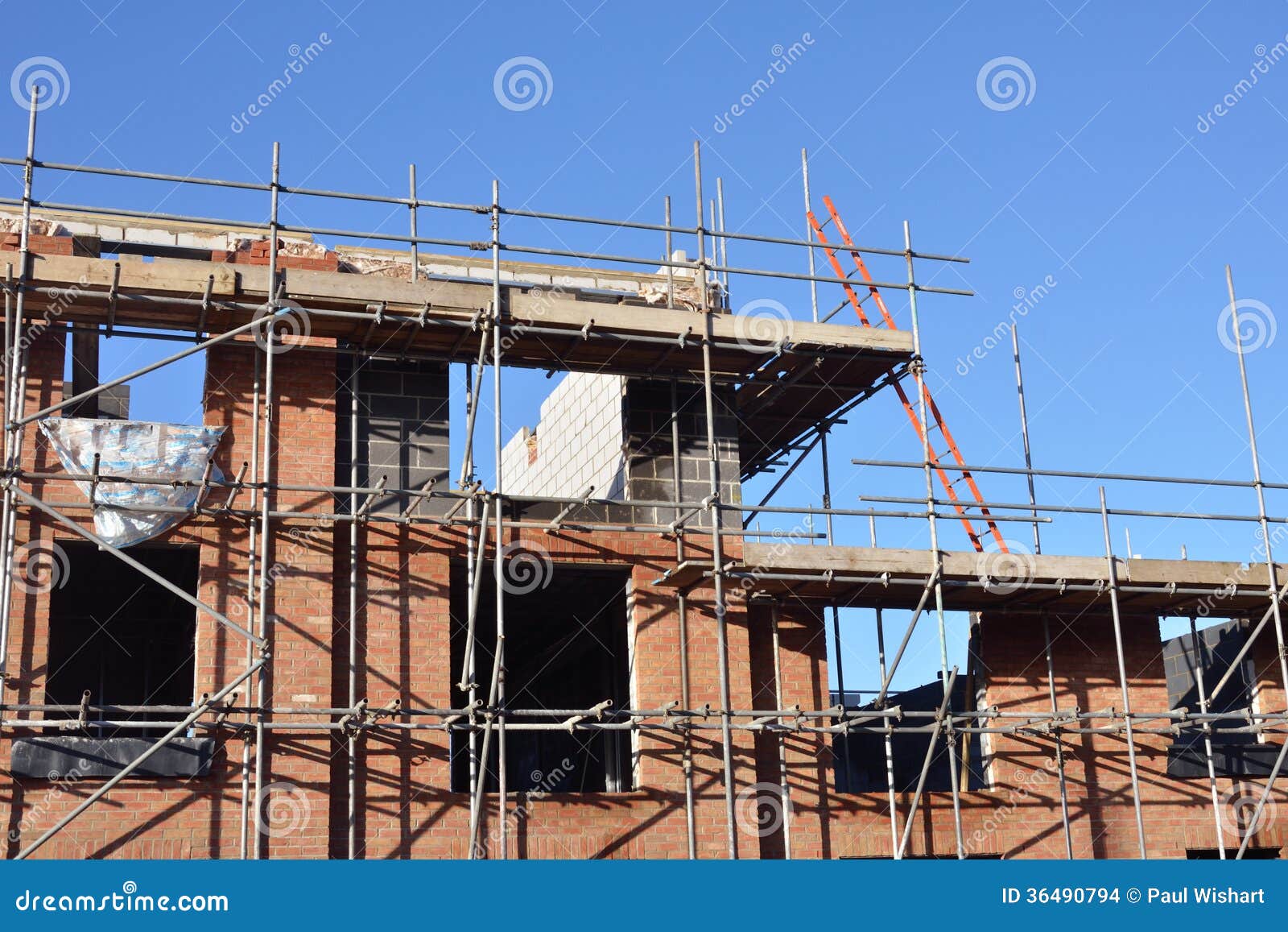 Red Brick Construction Site Stock Photo - Image of ladder, scaffold ...