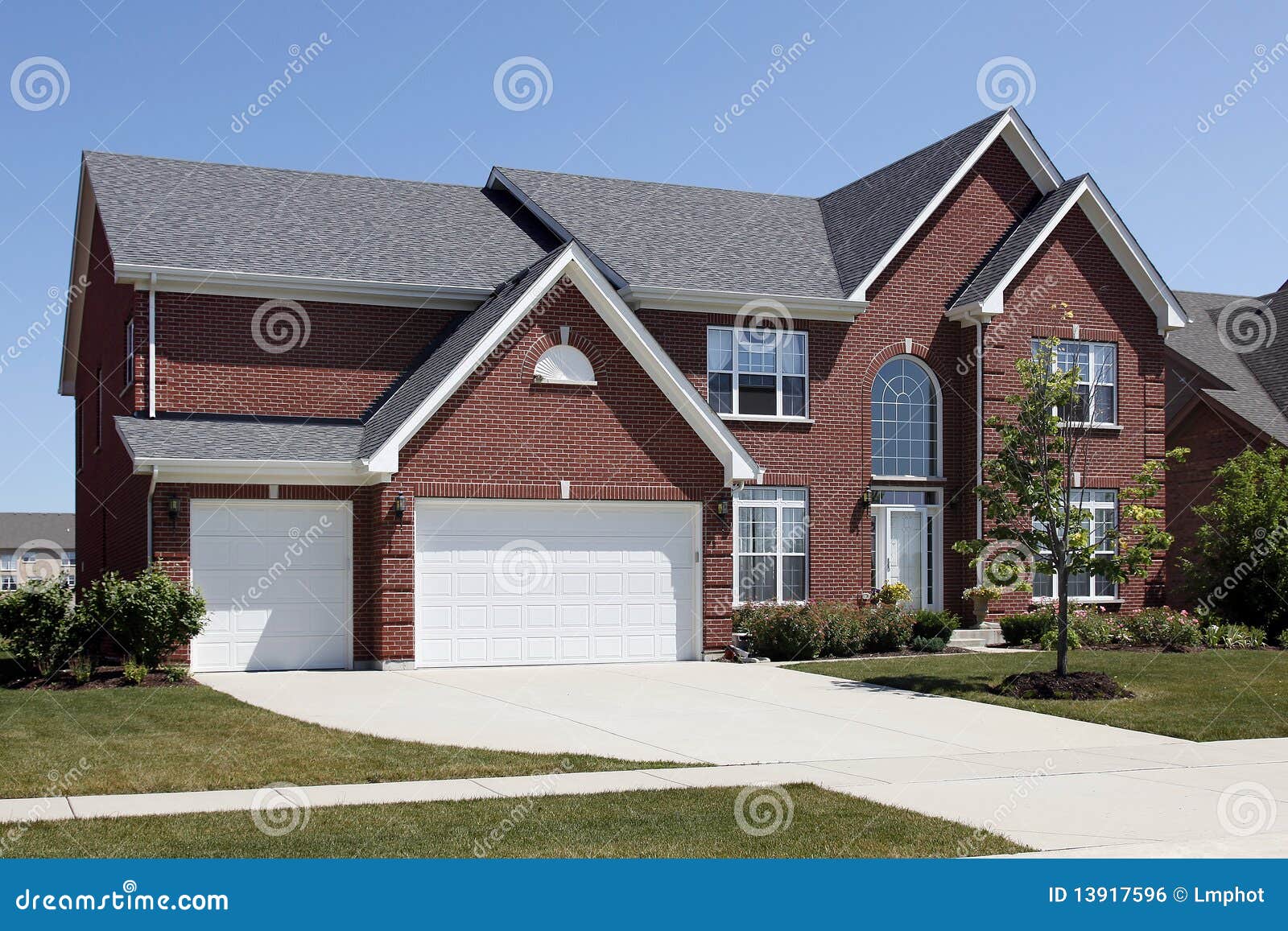 Red Brick Home with Three Car Garage Stock Photo - Image of luxury ...