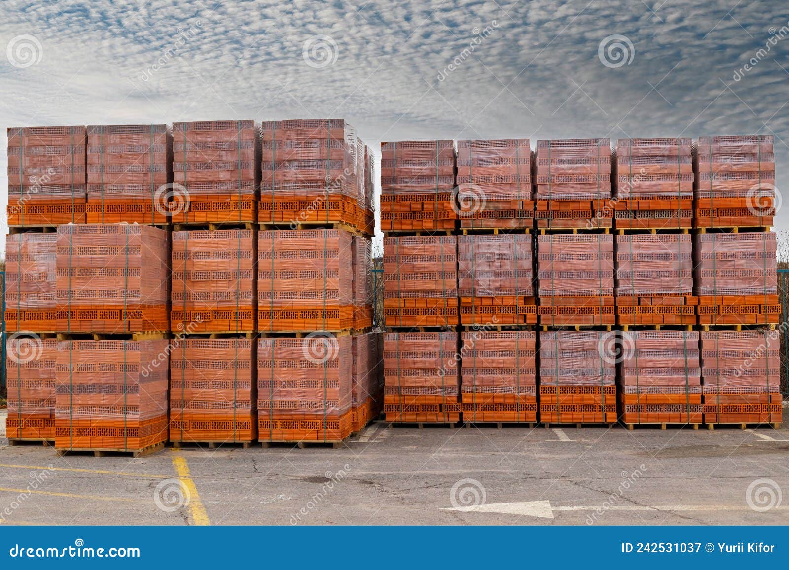 Red Brick Packed in Stacks are Stored on Ground Outdoors at a Hardware ...