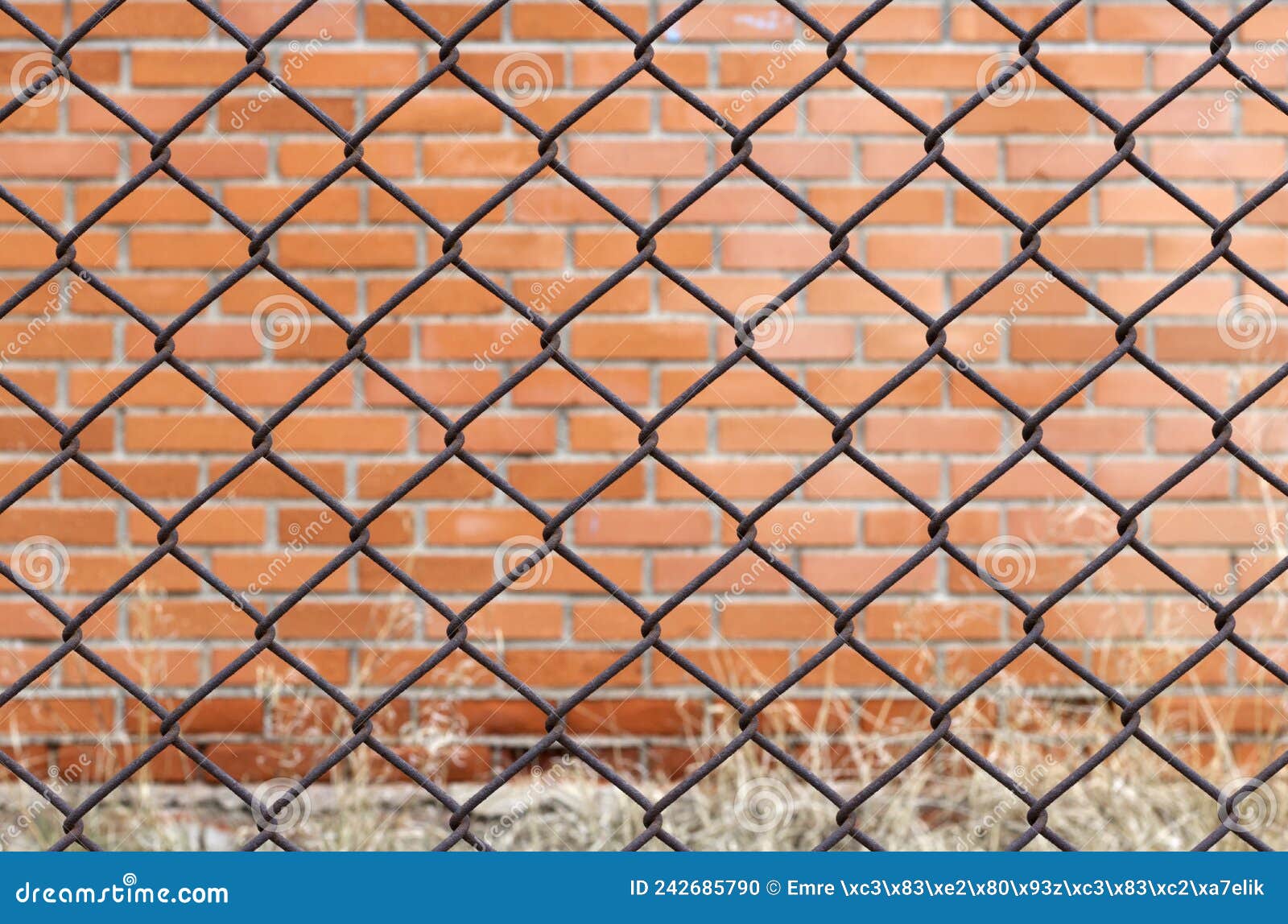 Red Brick Wall Behind Wire Mesh Wall Stock Photo - Image of frame, wire ...