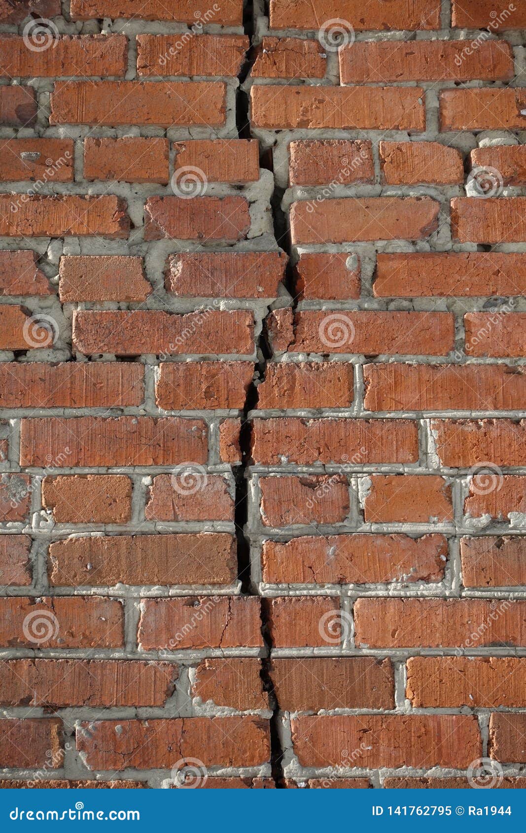 Red Brick Wall is Divided by a Vertical Crack. Separation Concept Stock ...