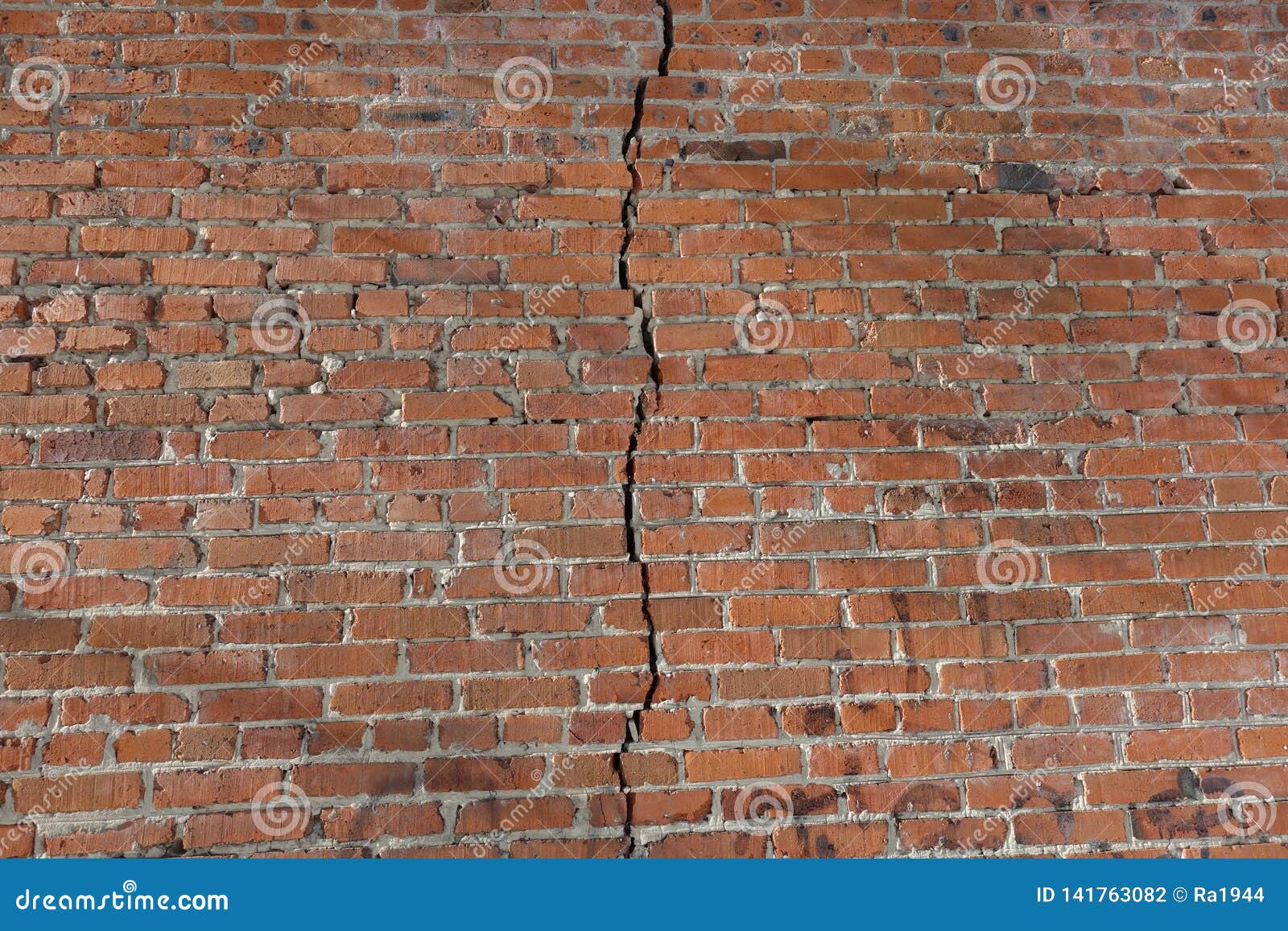 Red Brick Wall is Divided by a Vertical Crack. Separation Concept Stock ...