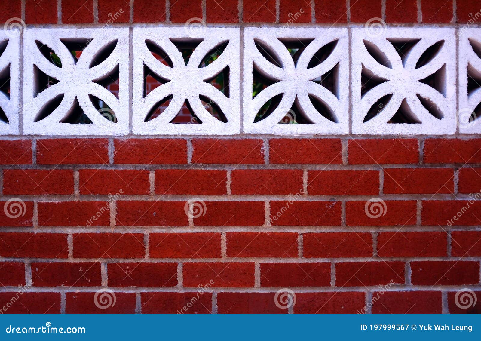 Red Brick Wall with Floral Concrete Blocks Close Up Stock Image - Image ...
