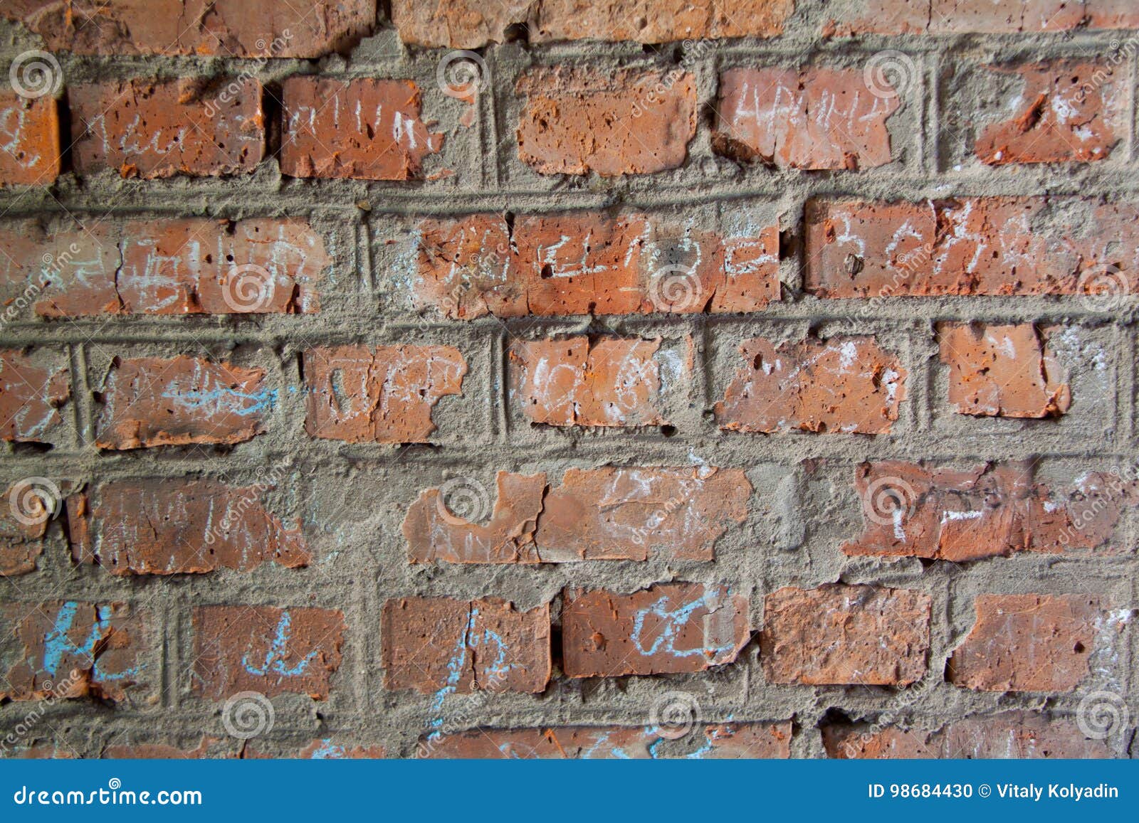 Red Brick Wall with Inscriptions in Chalk Stock Photo - Image of ...