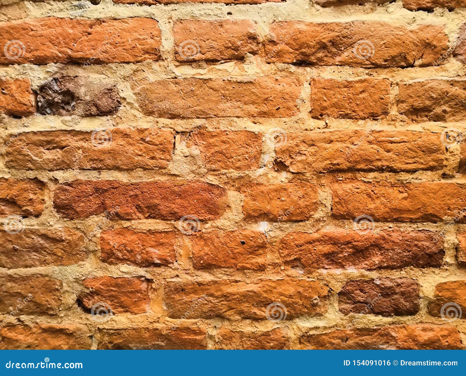 Red Brick Wall Under Yellow Light Stock Photo - Image of background ...