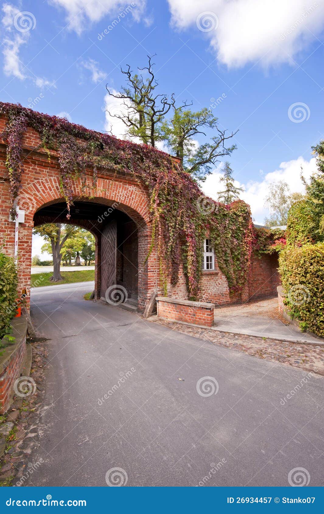 Red Bricked Building with Open Gate Stock Image - Image of doorway ...