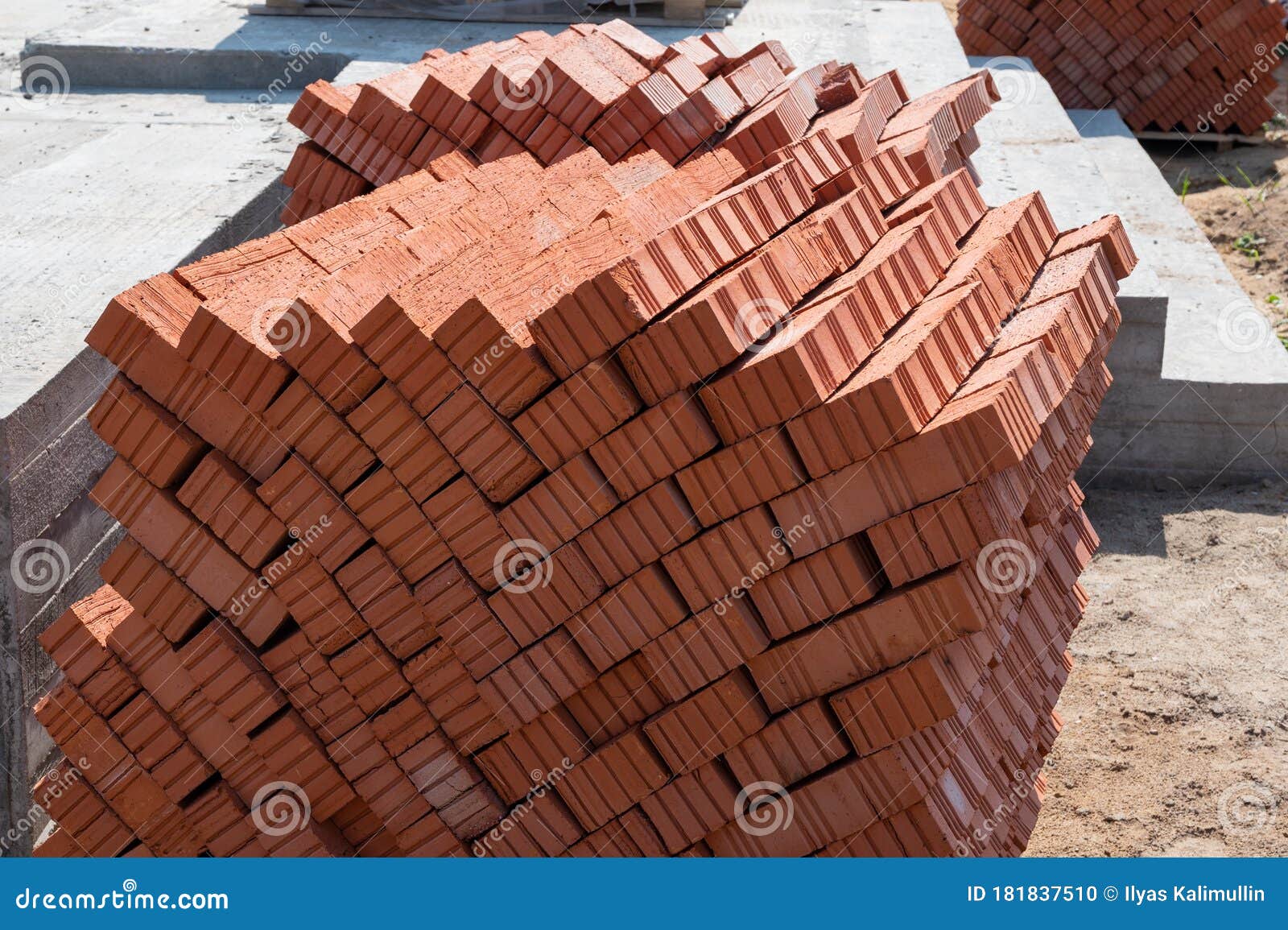 Red Bricks in Diagonal Stack with Concrete Foundation on Background ...