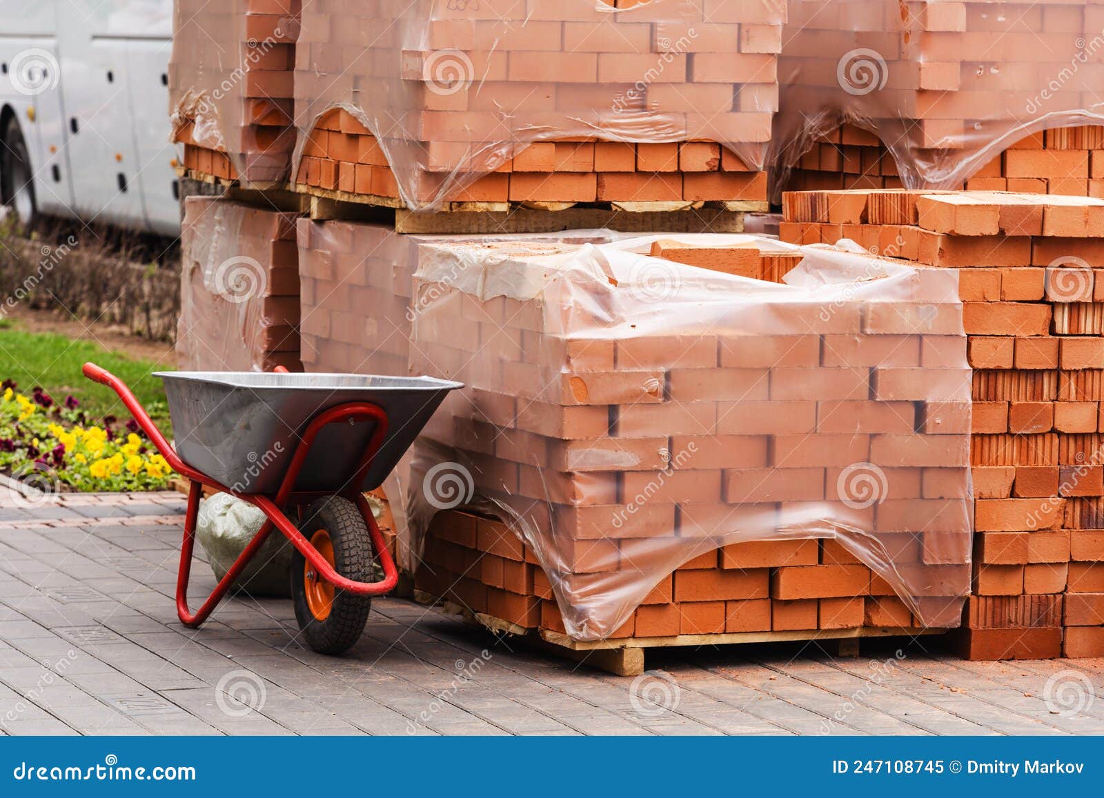 Red Bricks in Large Packages on a Construction Site. Trade and Delivery ...