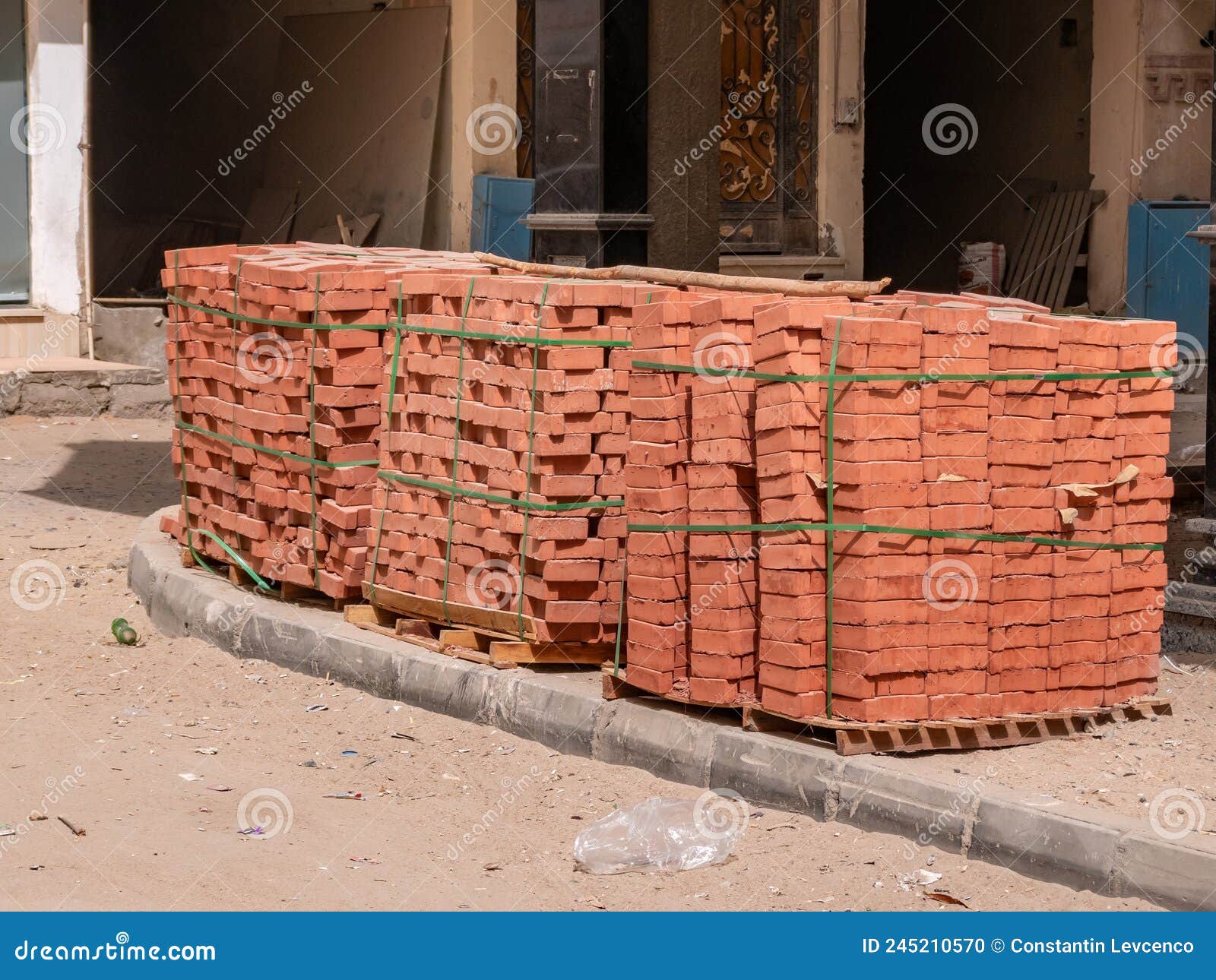 Red Bricks Packed in Piles are Stored Outdoors. Construction Material ...