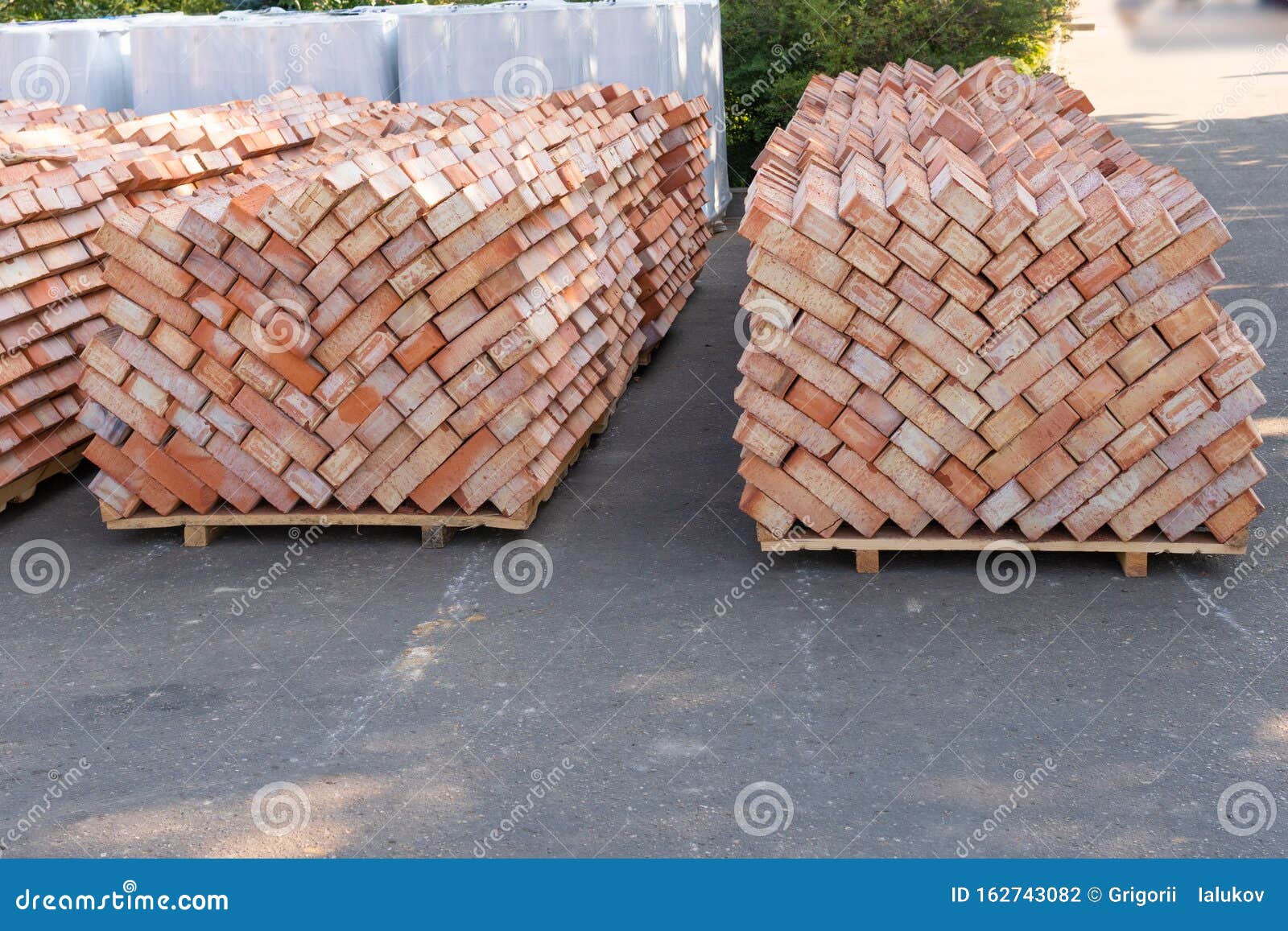 Brown Bricks Stacked Together To Build a House Stock Photo - Image of ...