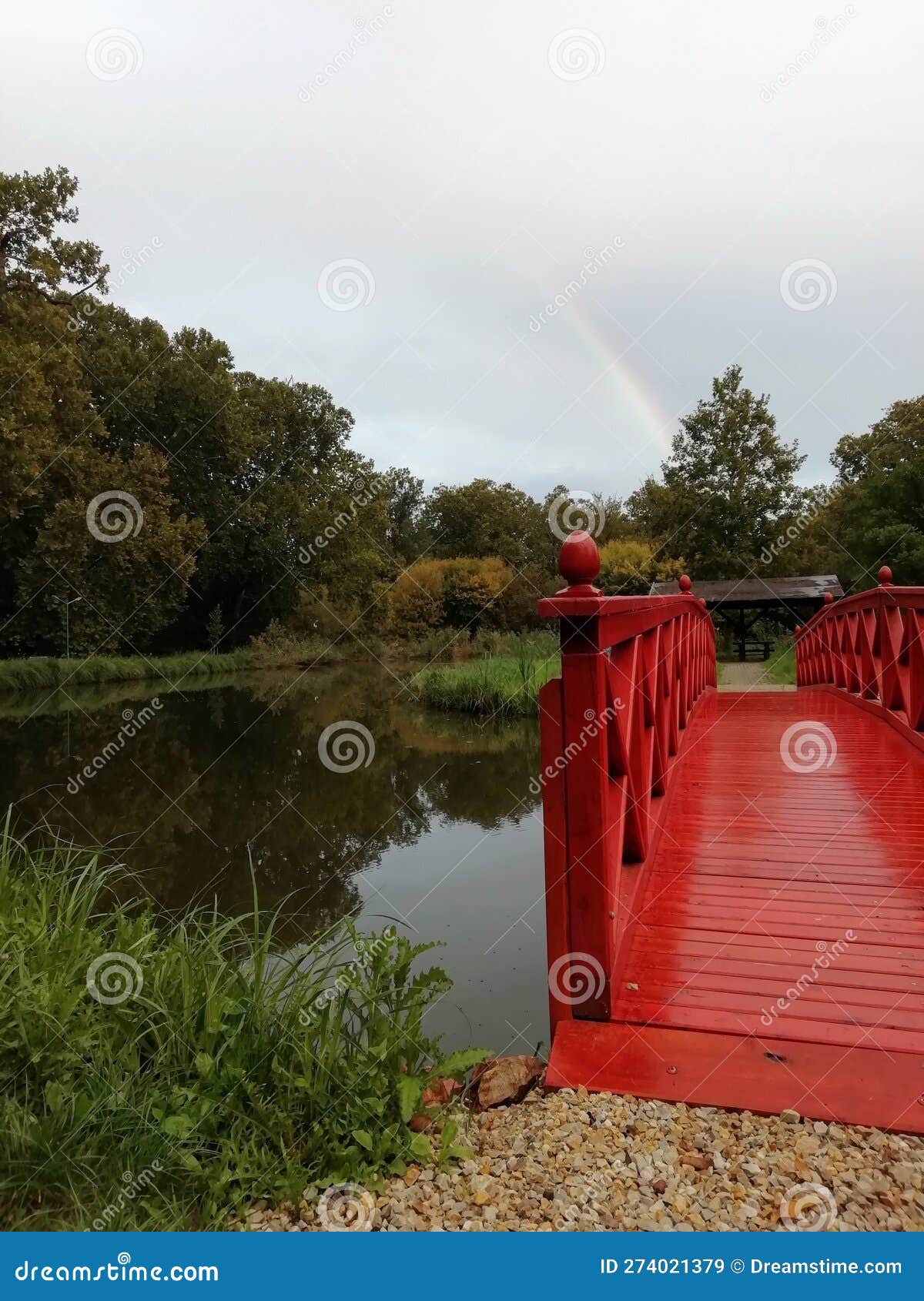 A red bridge on the lake. stock image. Image of park - 274021379