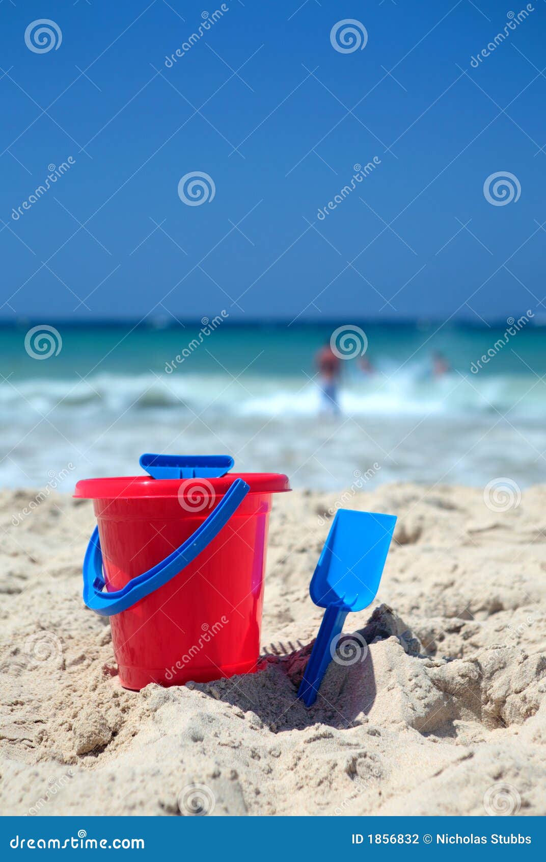 Red Bucket and Blue Spade on Sunny Sandy Beach Stock Photo - Image of ...