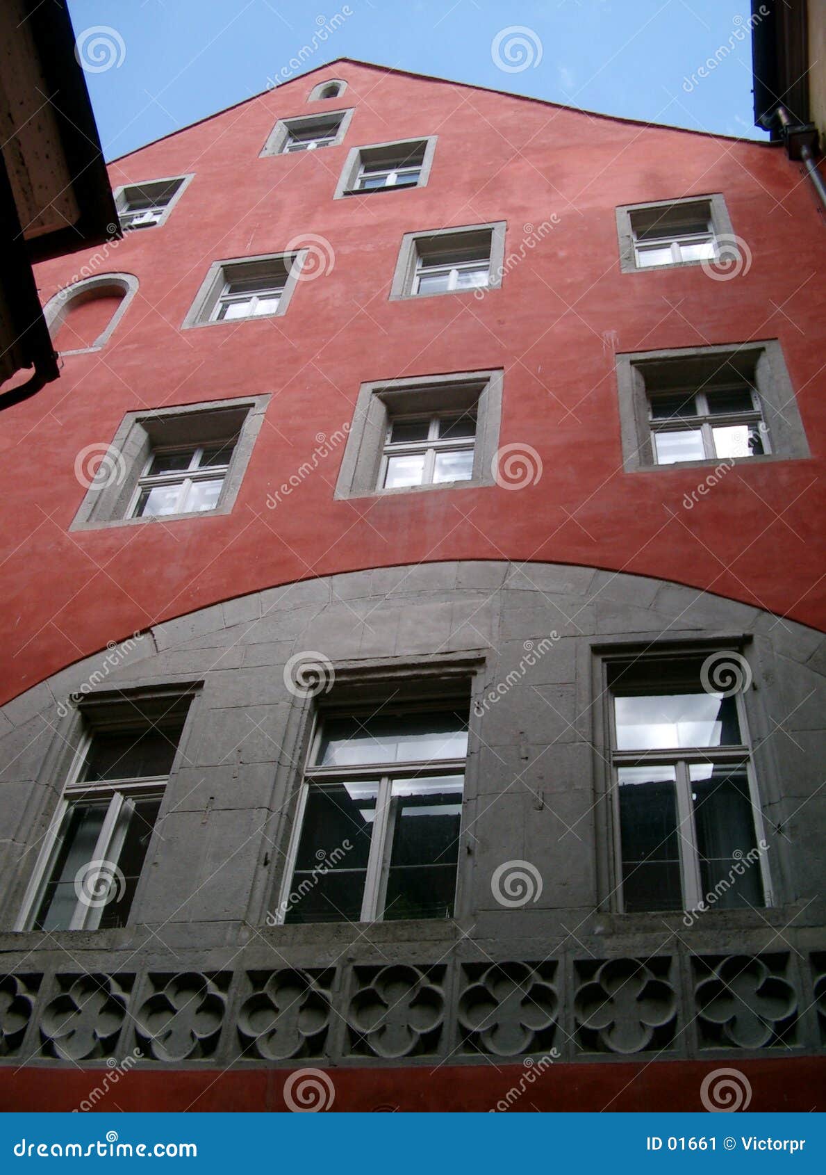 Red building with windows stock image. Image of building - 1661