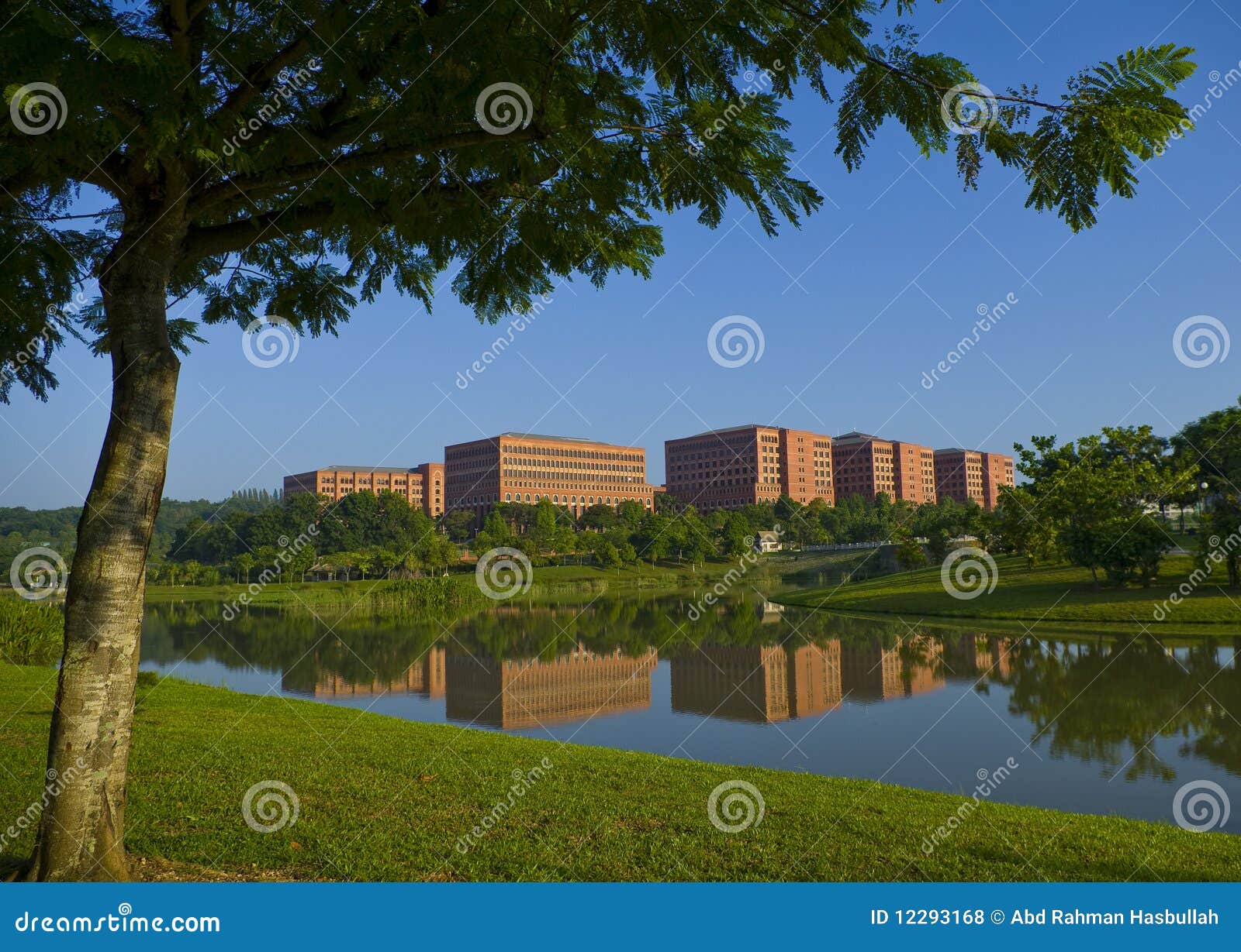 Red Buildings on lakeside stock photo. Image of reflection - 12293168