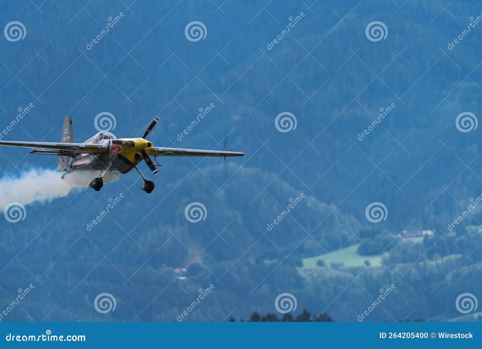 Red Bull Plane in Flight with a Smoke Trail Editorial Image - Image of ...