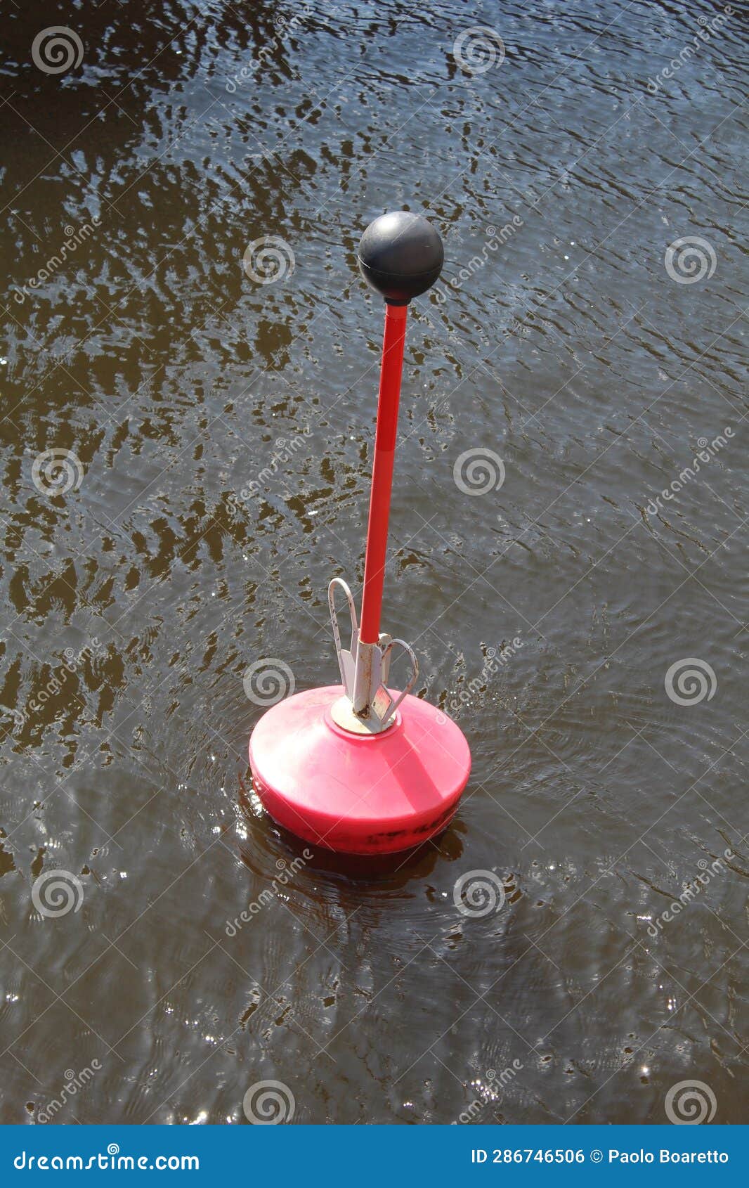 A Red Buoy Floats on the Surface of the River Stock Photo - Image of ...