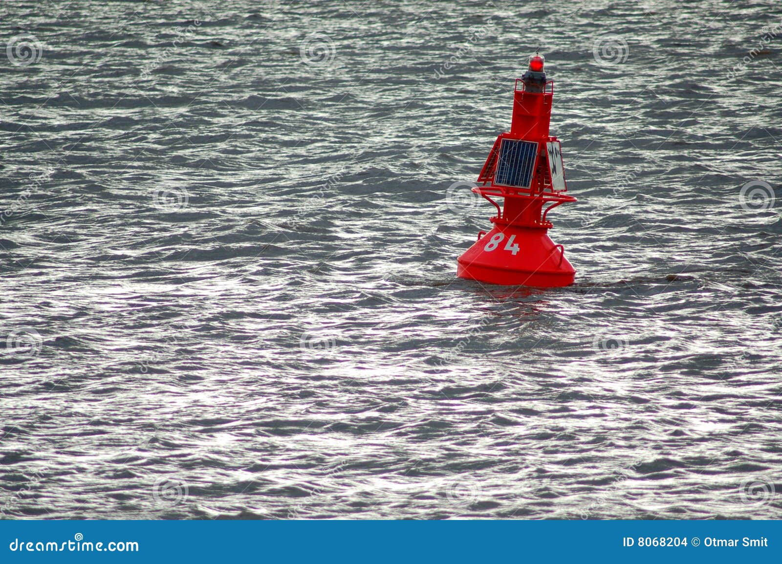 Red buoy with solar panel stock photo. Image of waves - 8068204