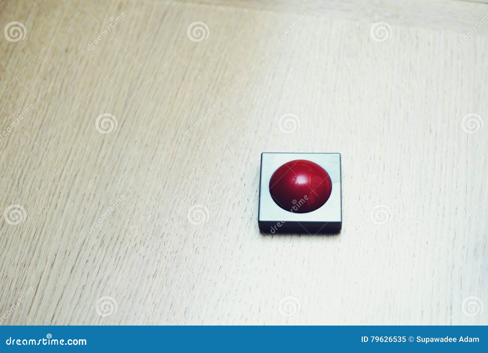 Red button on wood table. stock image. Image of reflection - 79626535