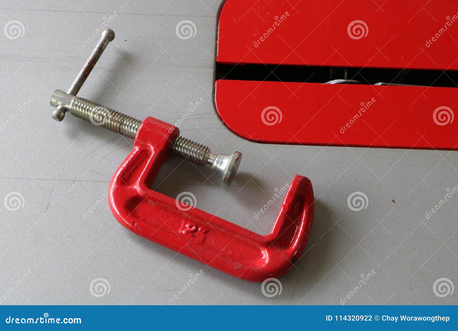 Red C-clamp on Table Saw Background Stock Photo - Image of handle ...