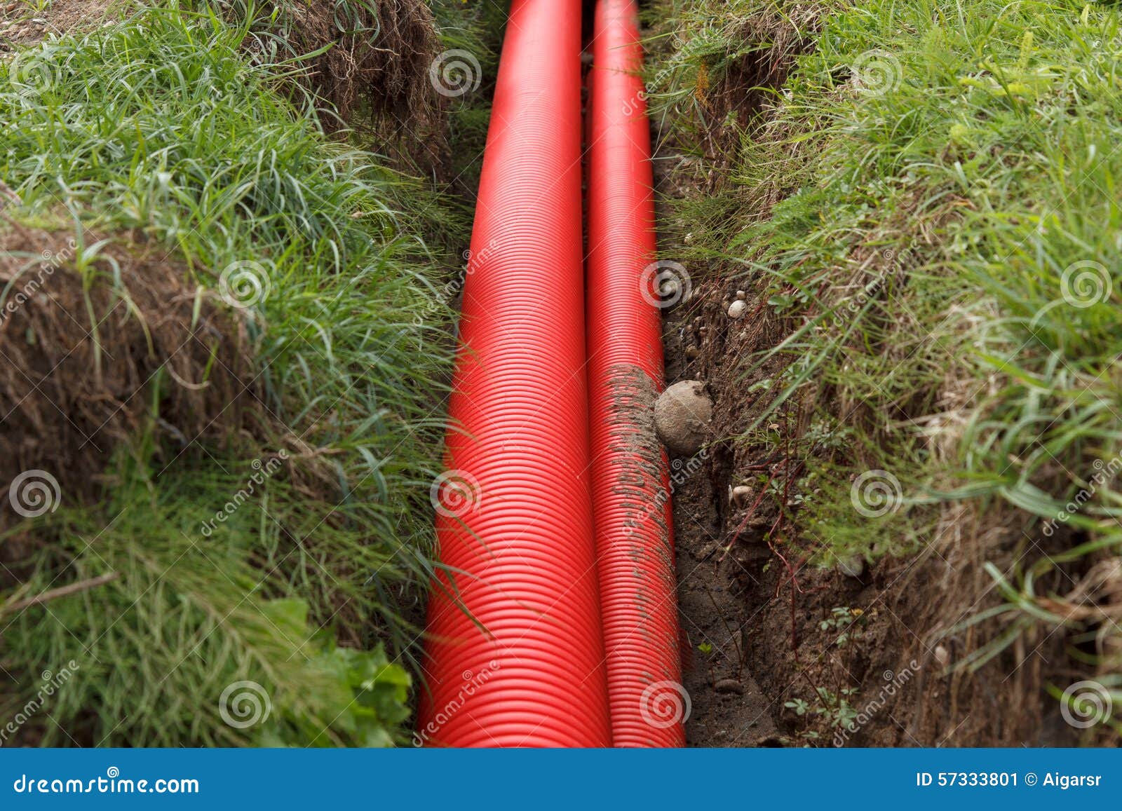 Red cable pipes stock image. Image of industry, ditch - 57333801